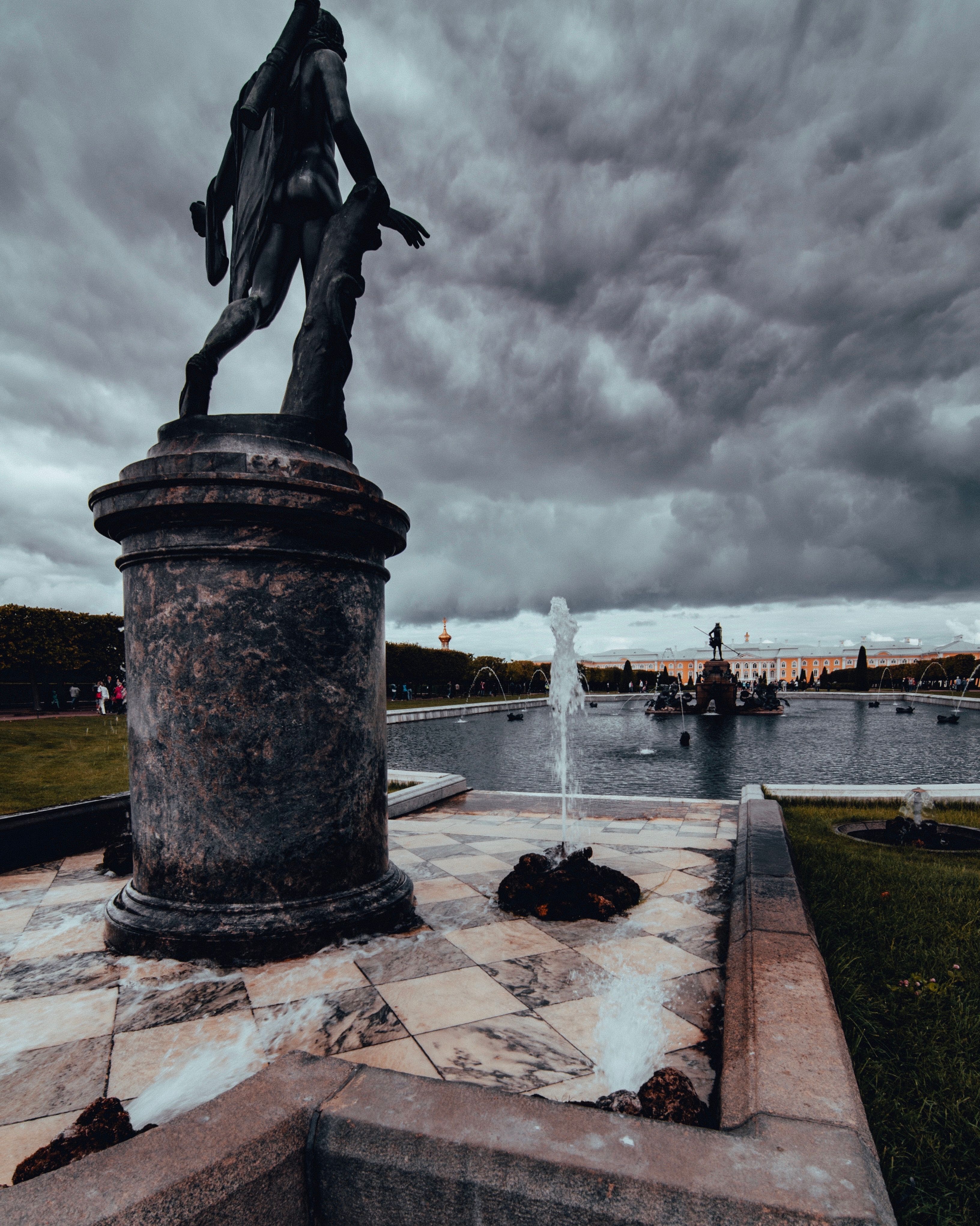 Statues in Front of a Water Fountain · Free Stock Photo