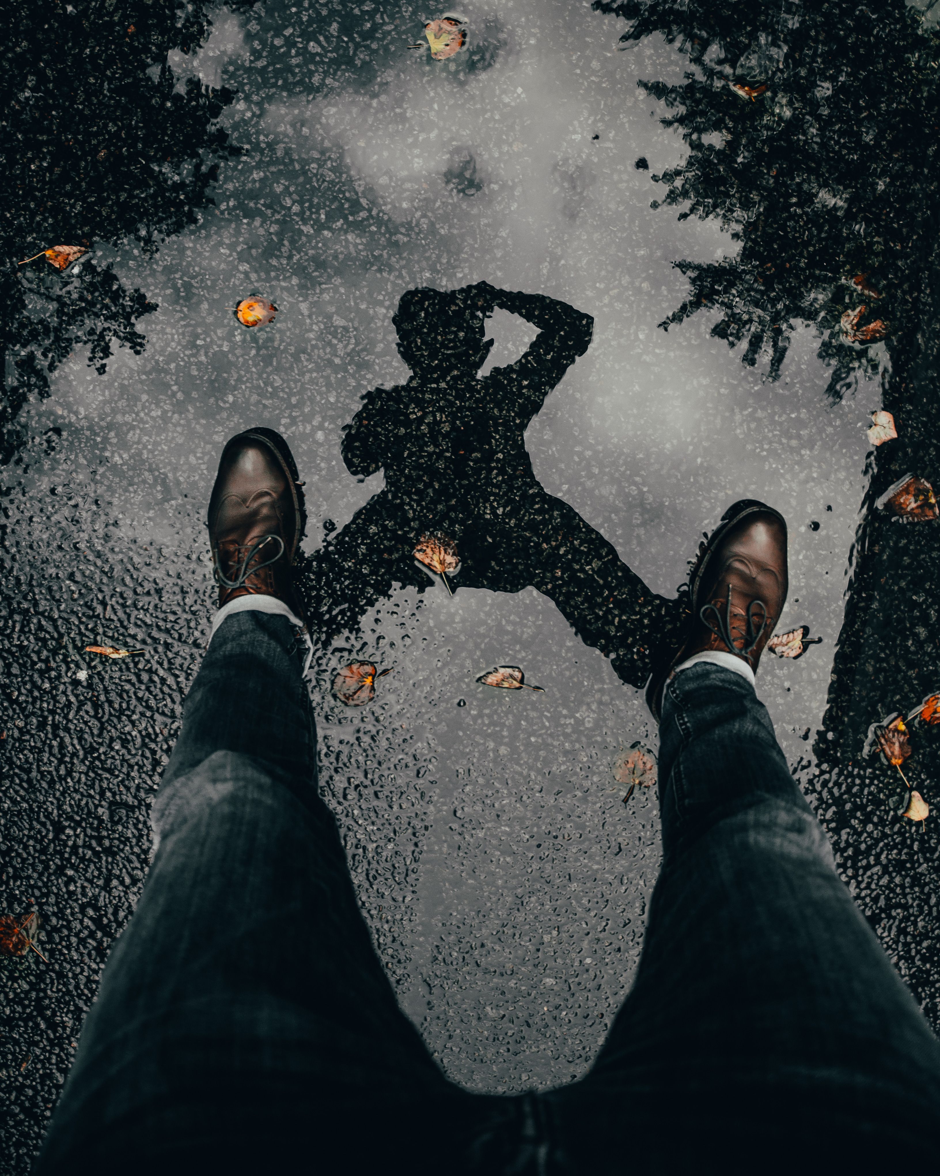 Person Standing on Puddle · Free Stock Photo