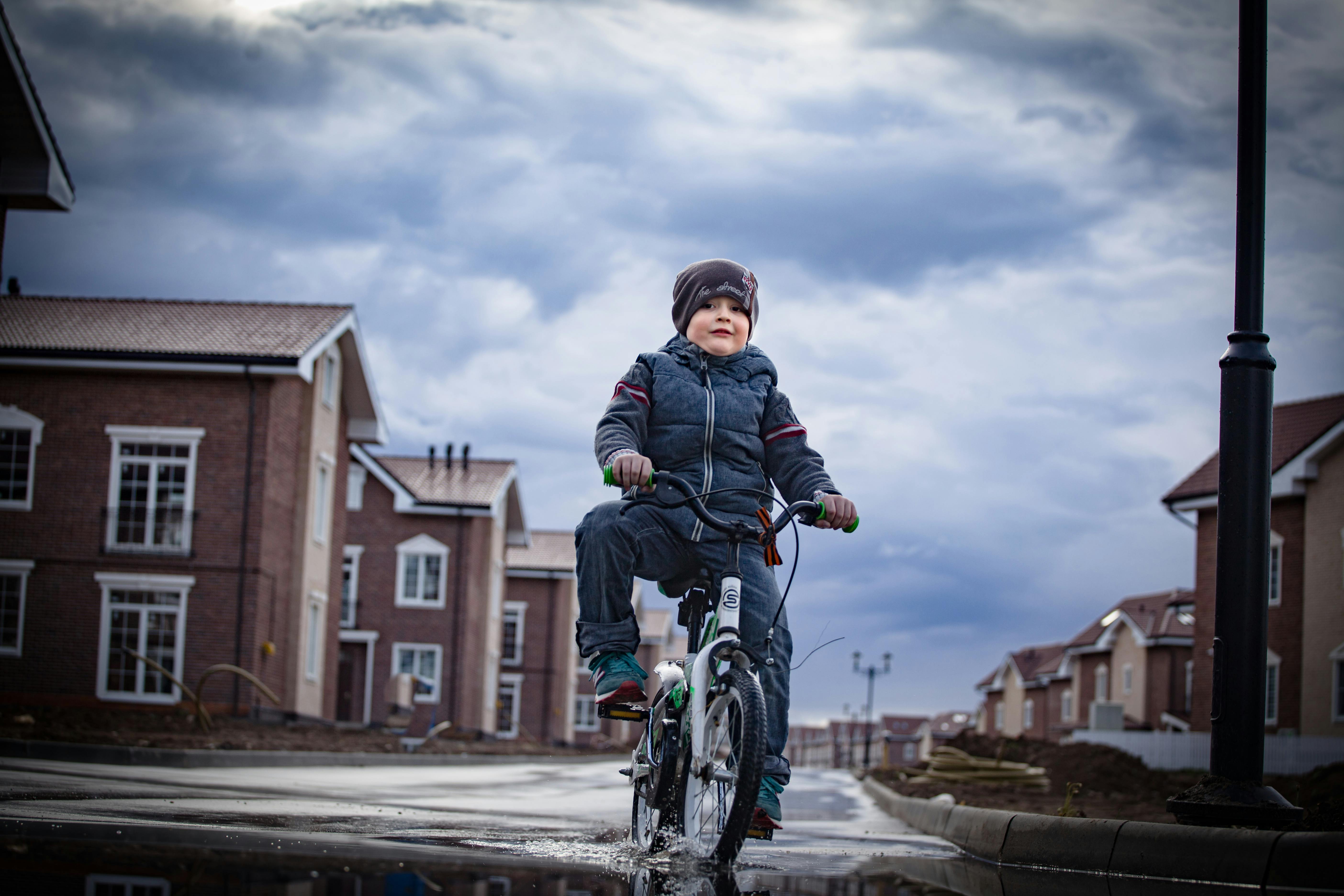 Boy Riding a Bicycle · Free Stock Photo
