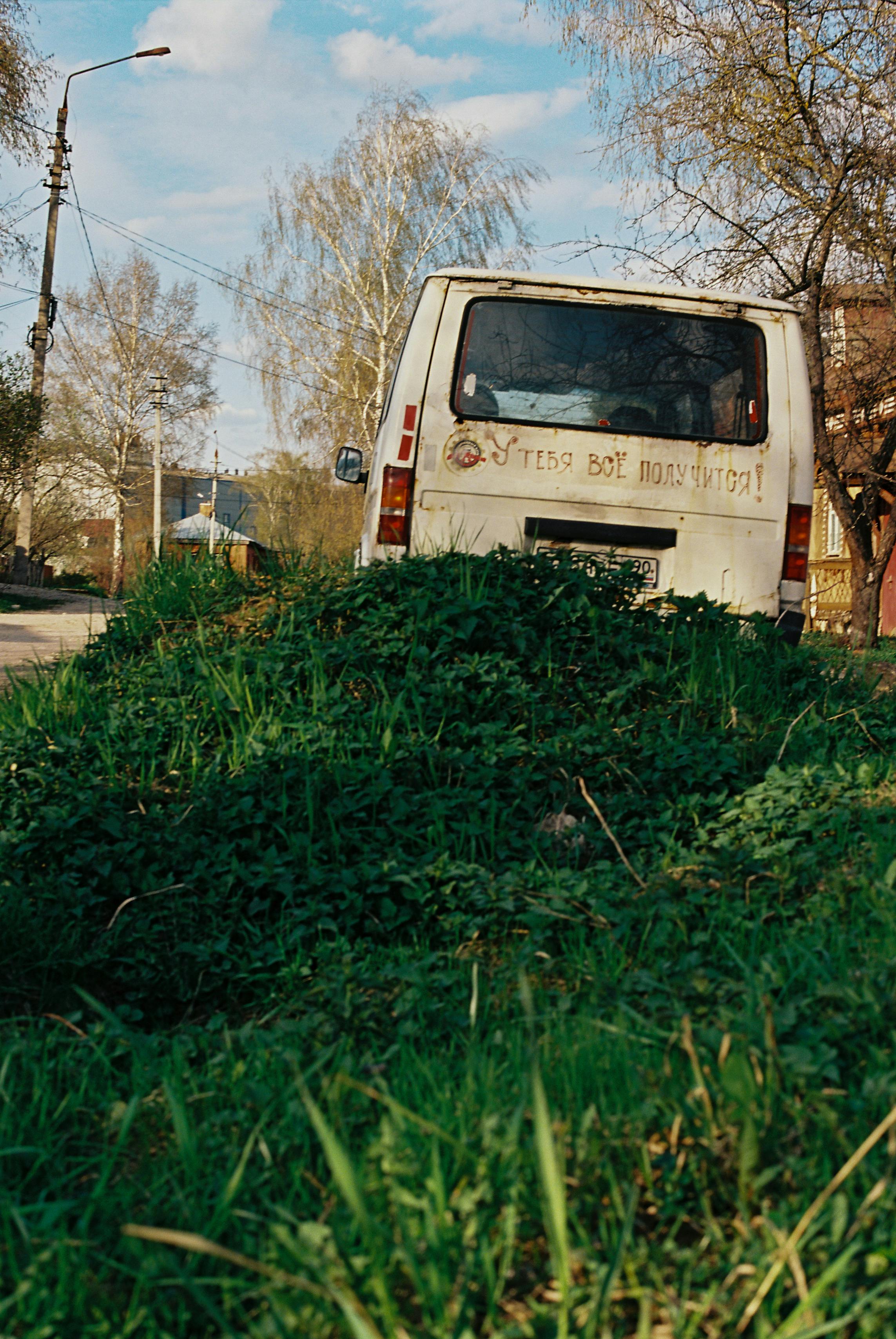 White Van Parked on the Street · Free Stock Photo
