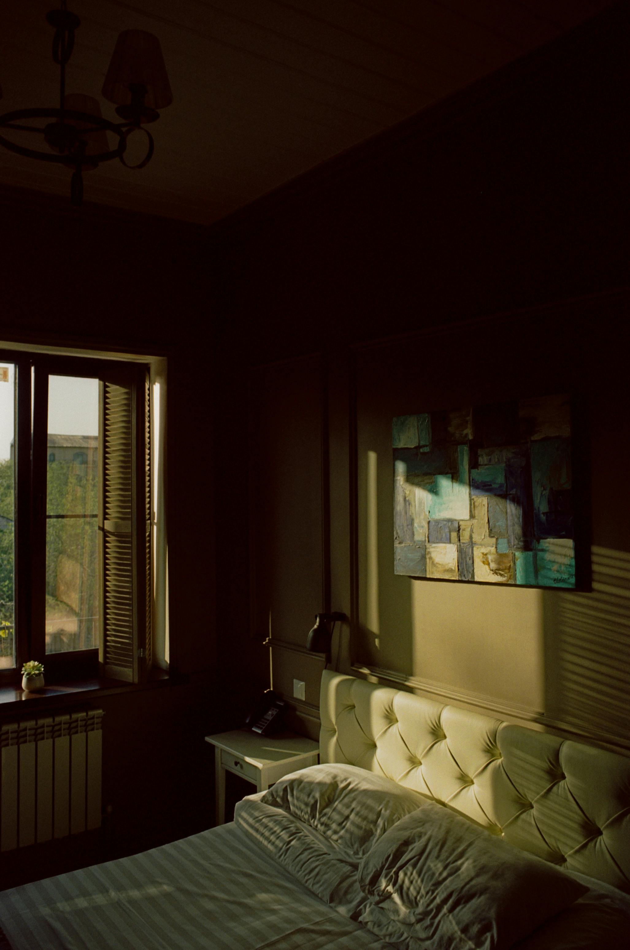 Dark Bedroom in Disarray · Free Stock Photo