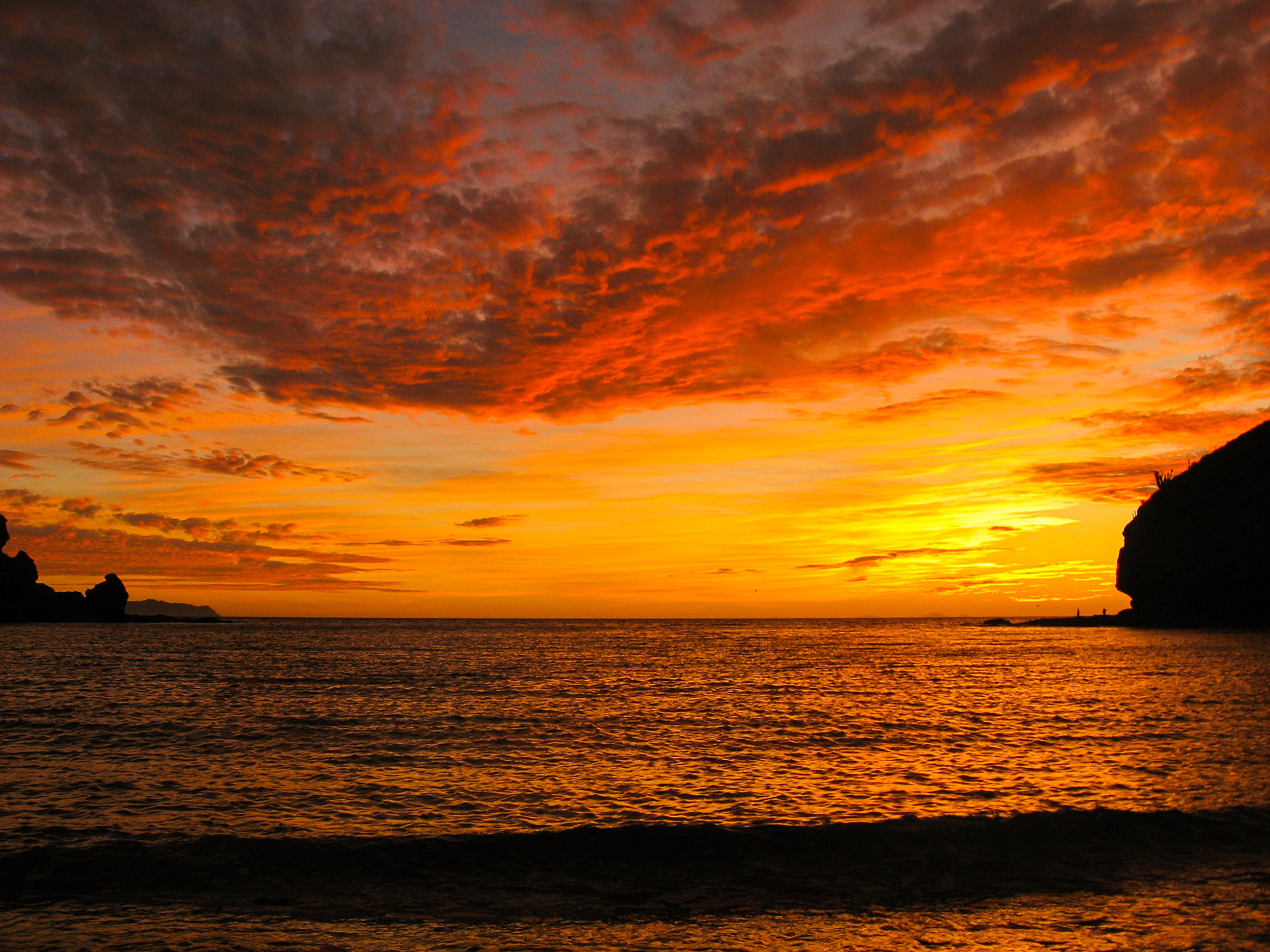 Dramatic Sunset Sky over a Sea · Free Stock Photo