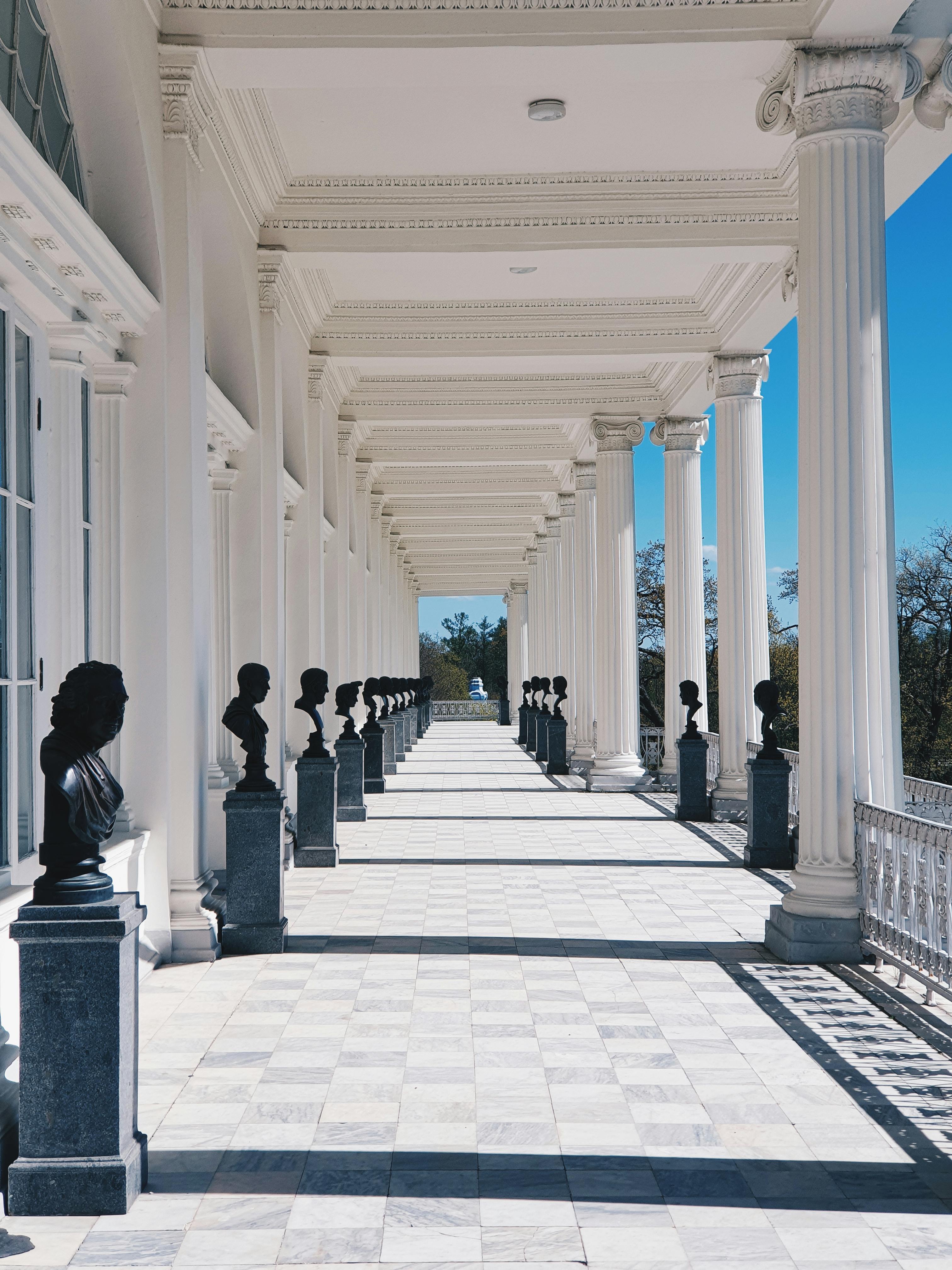 Perspective of a Terrace with White Columns and Black Busts · Free ...