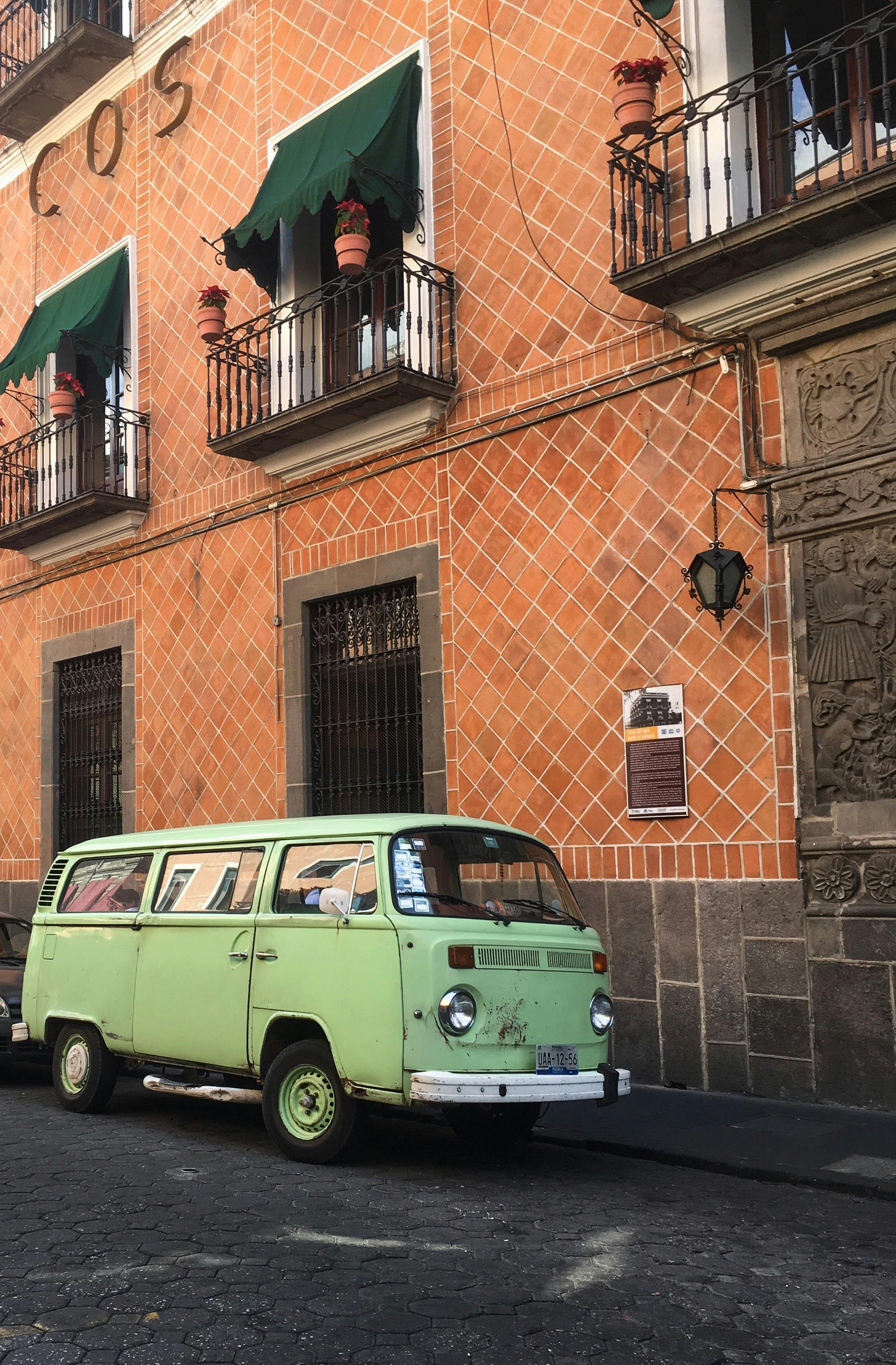 Light Green of Volkswagen Van Near Building · Free Stock Photo
