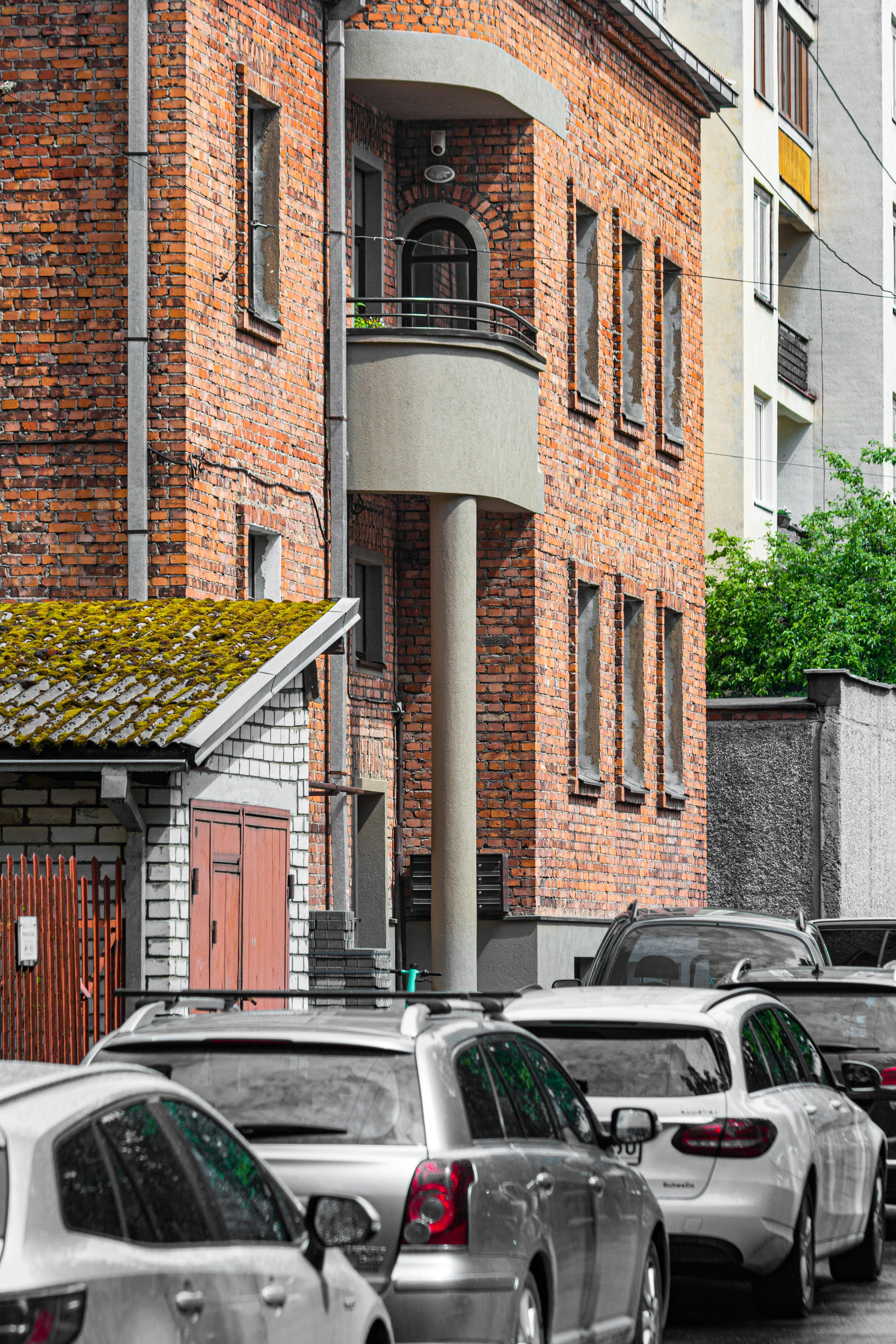 Typical buildings with cars on street · Free Stock Photo