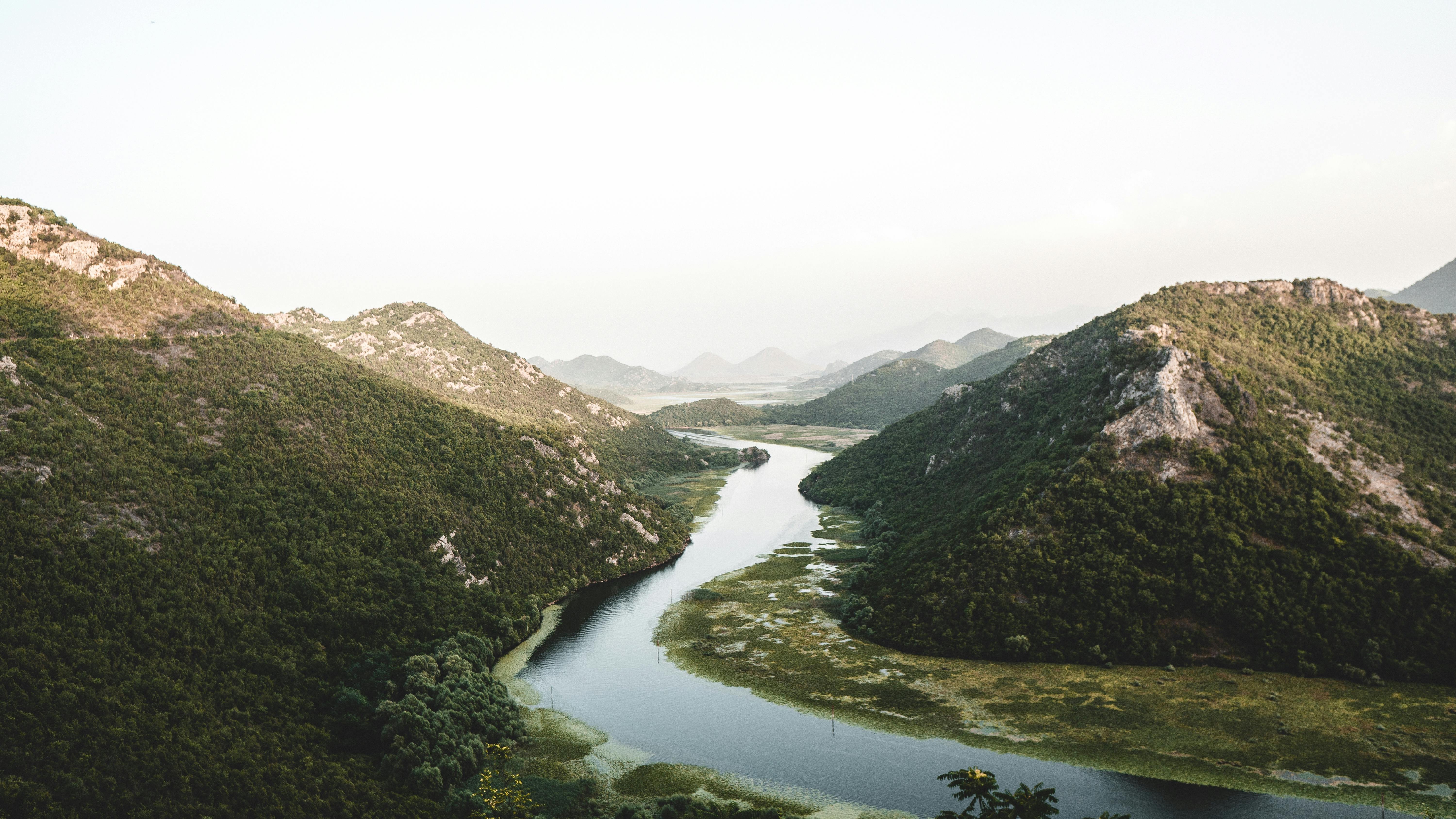 River in Between Mountains · Free Stock Photo