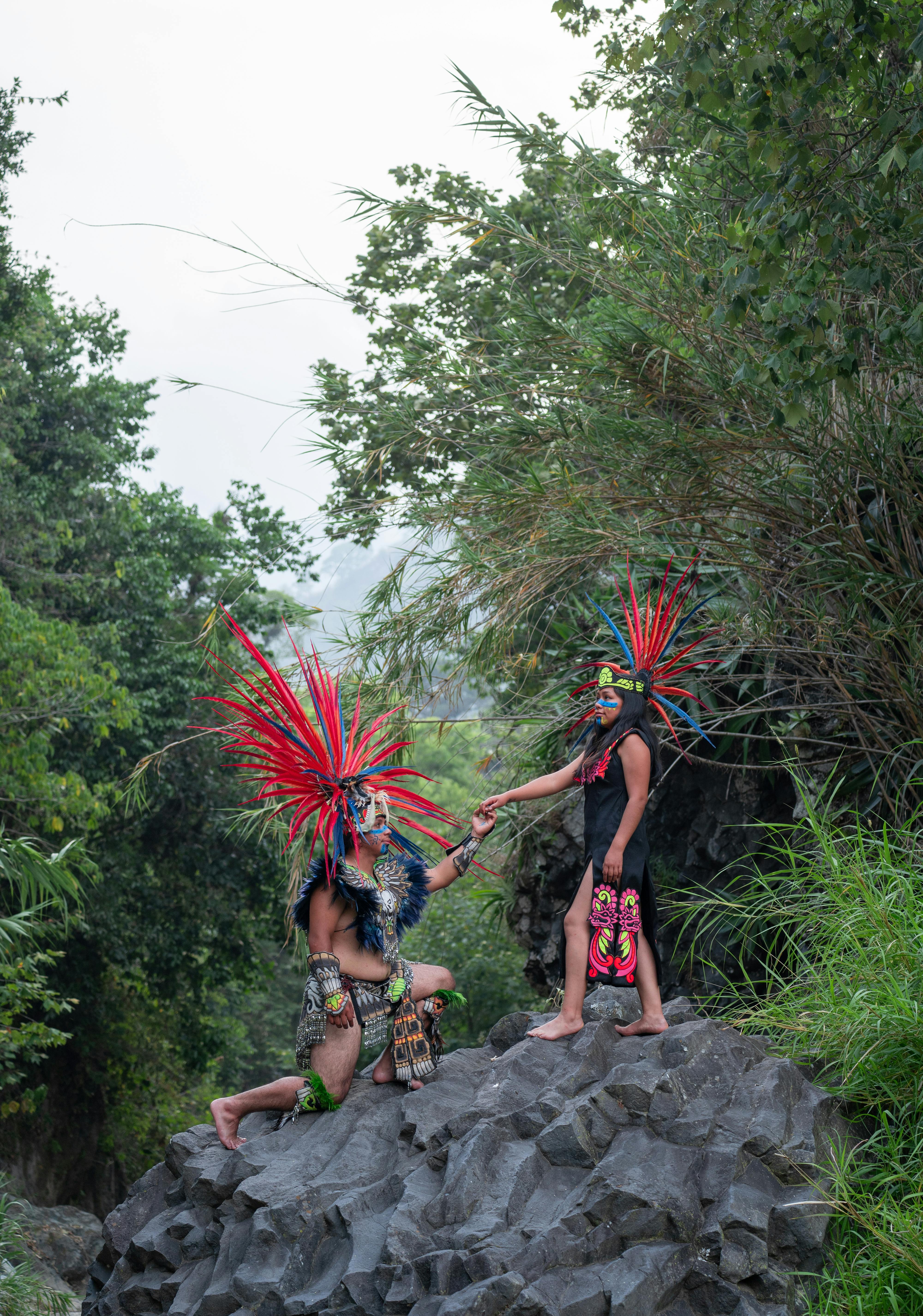 Man Kneeling in Front of a Woman in a Traditional Native Tribe Costume ...