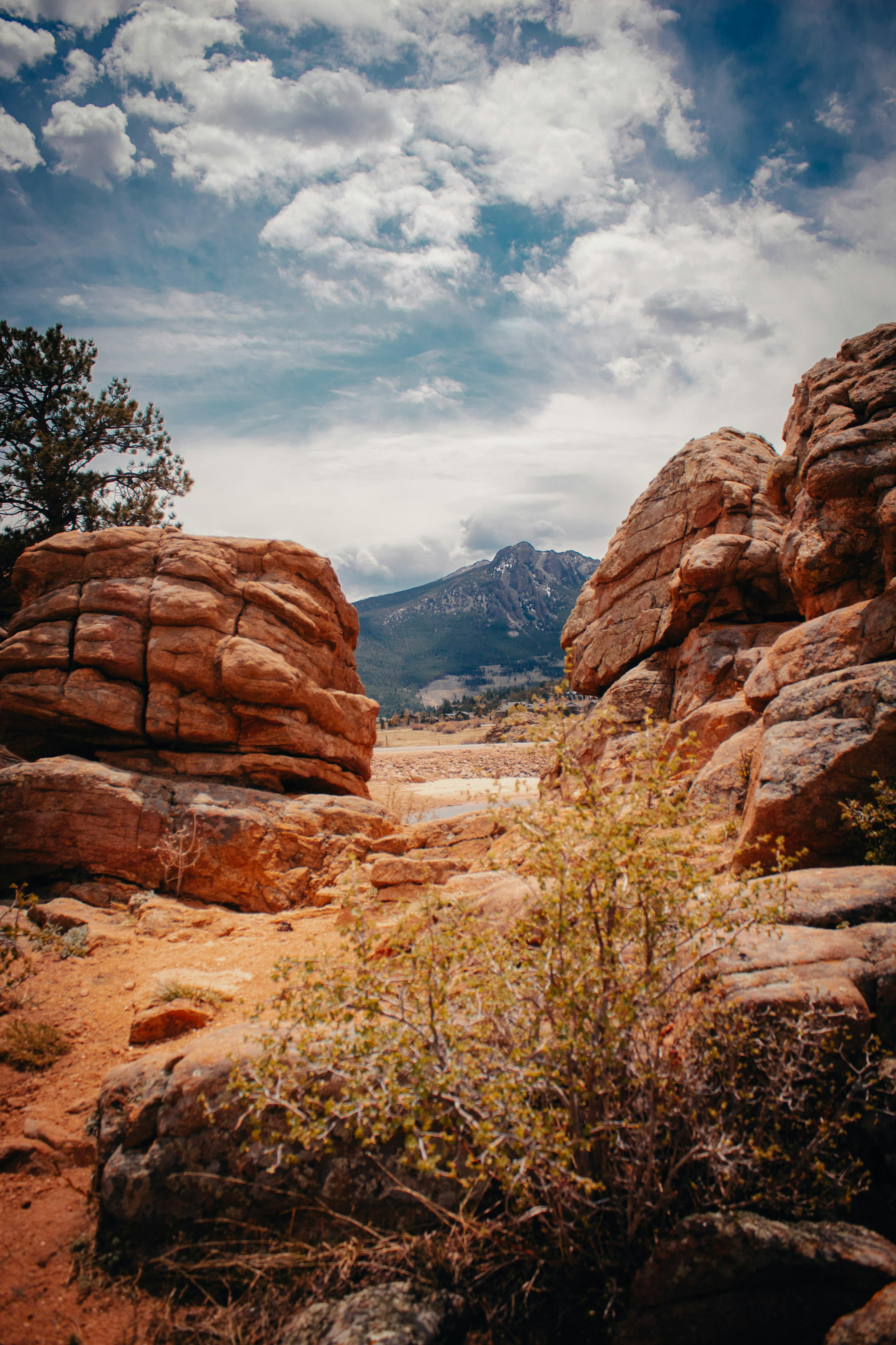 Gray Rock Formation under Blue Sky and White Clouds · Free Stock Photo