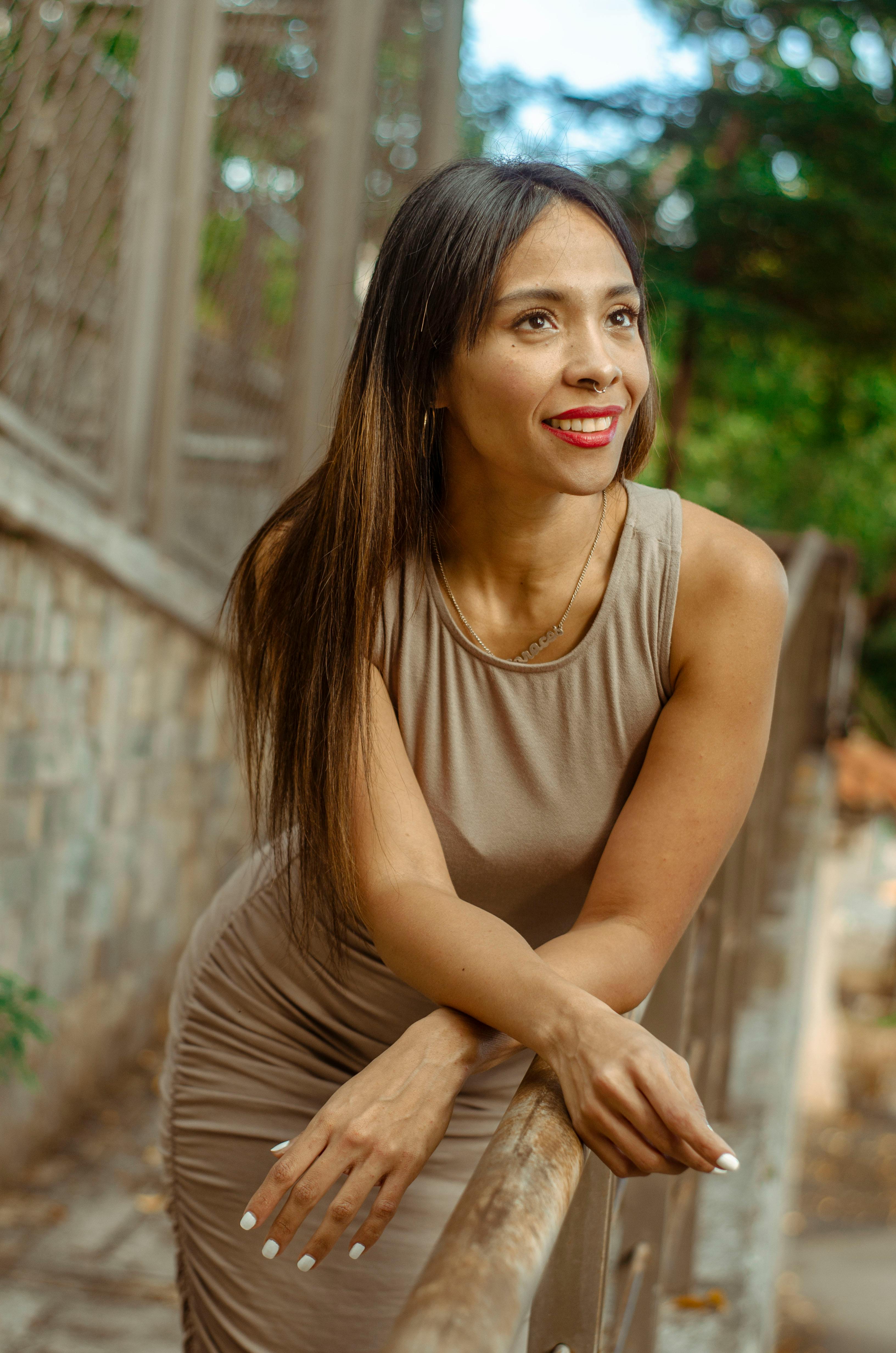 A Woman Leaning Forward to a Window while Looking Afar · Free Stock Photo