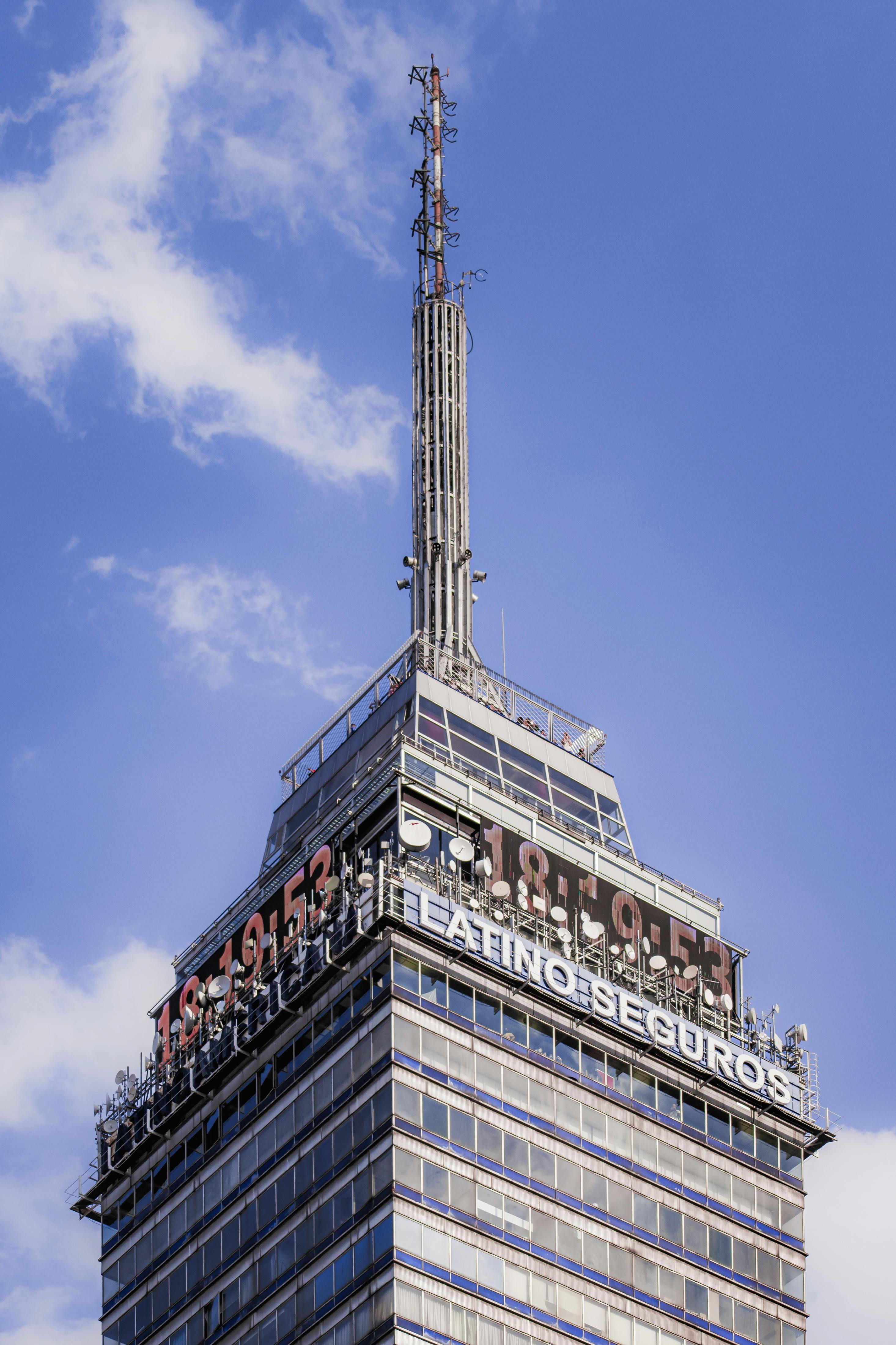 Skyscraper with Antenna and Clock · Free Stock Photo