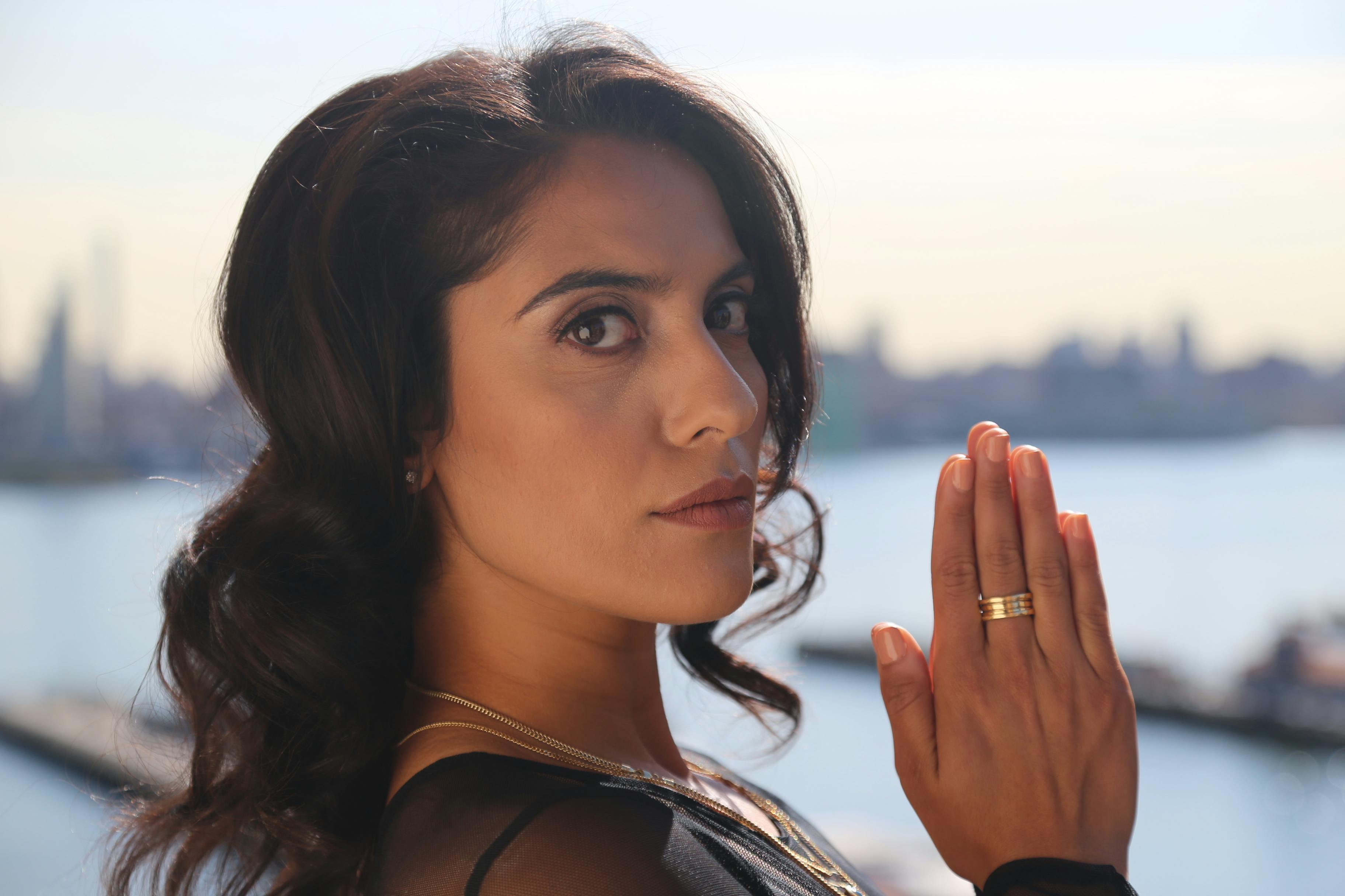 Woman Resting her Chin on her Hand · Free Stock Photo