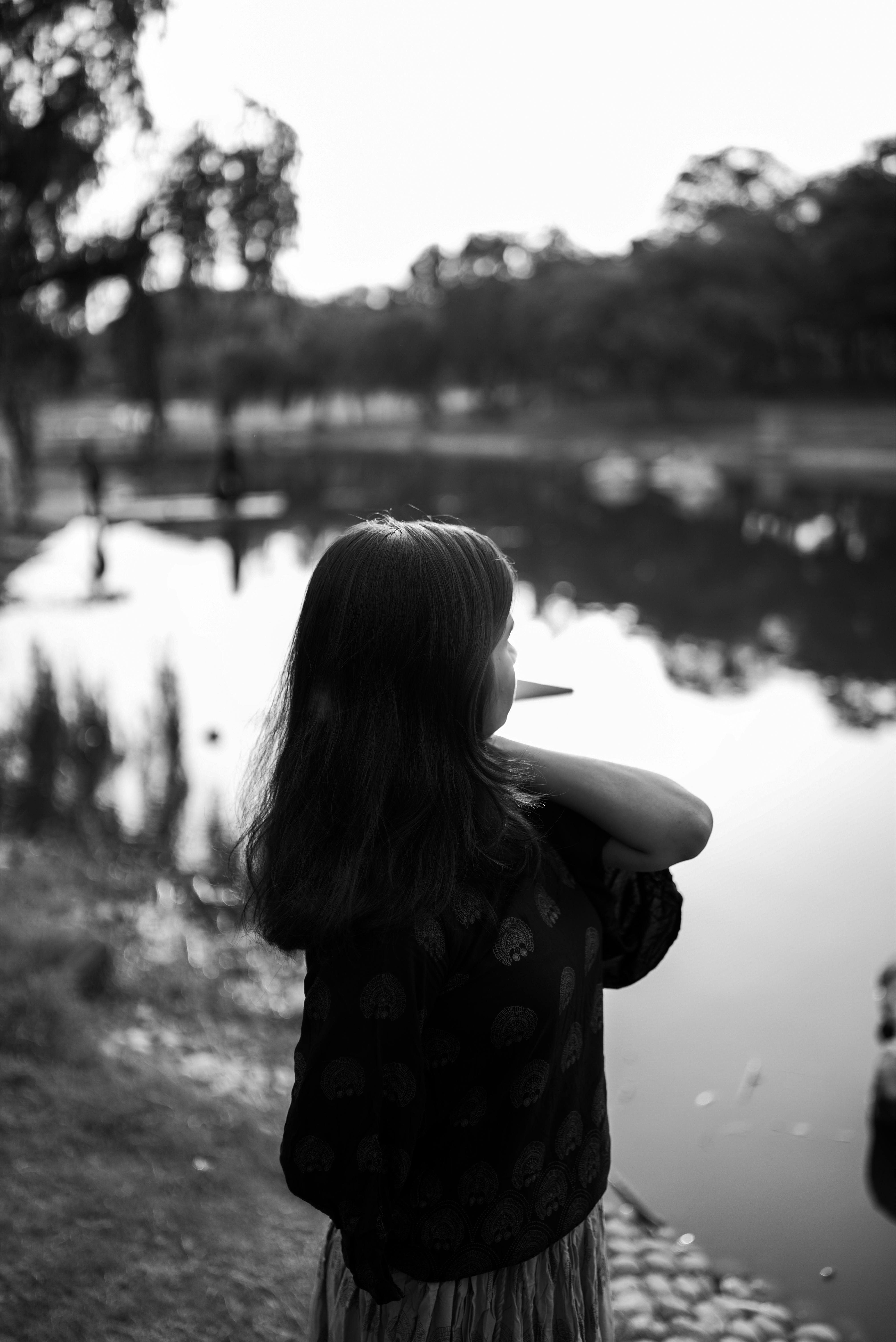 Two Girls Standing Back to Back · Free Stock Photo