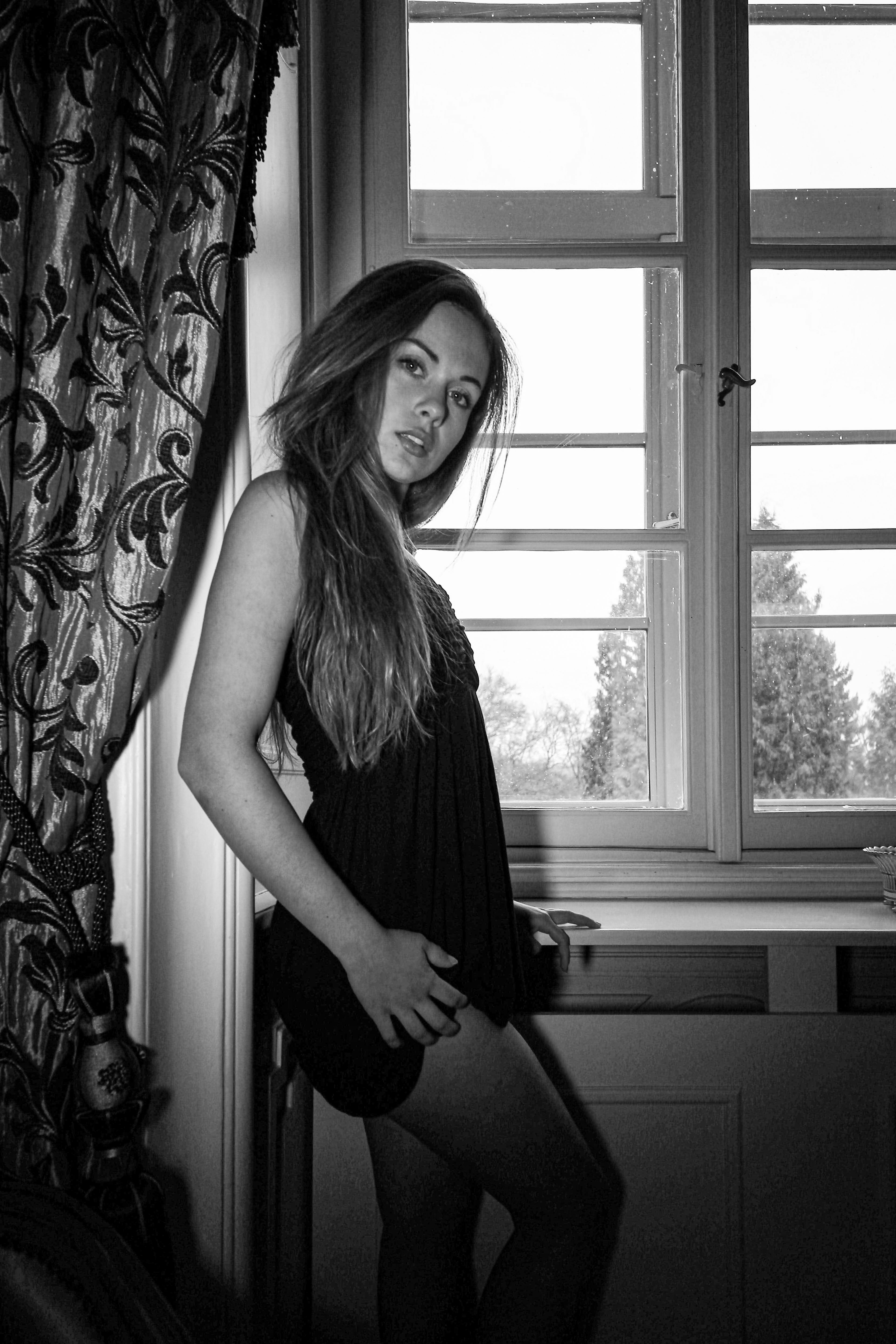 Grayscale Photo of Woman Reading Magazine · Free Stock Photo