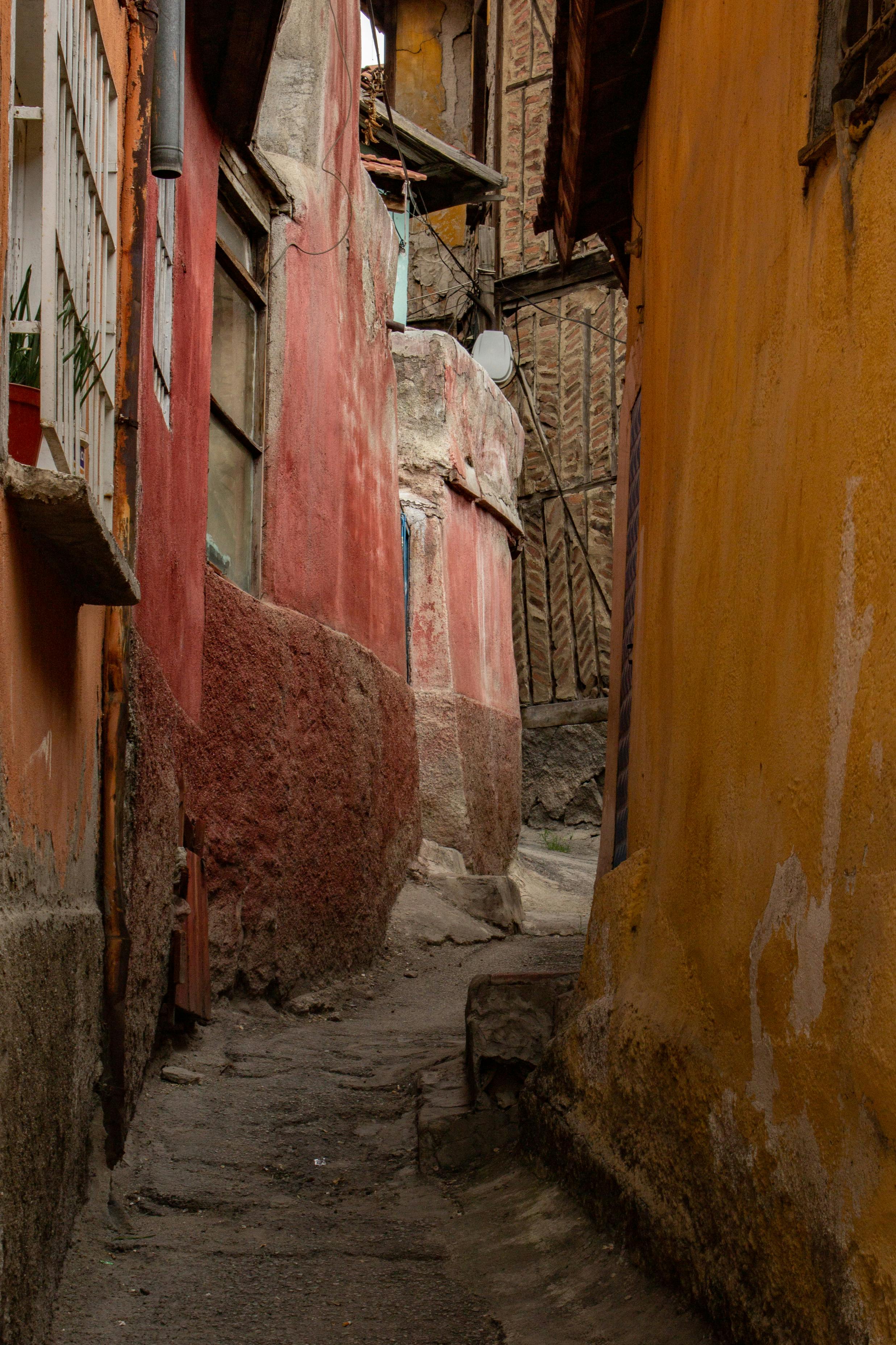 View of a Narrow Illuminated Alley between Buildings in City at Night ...