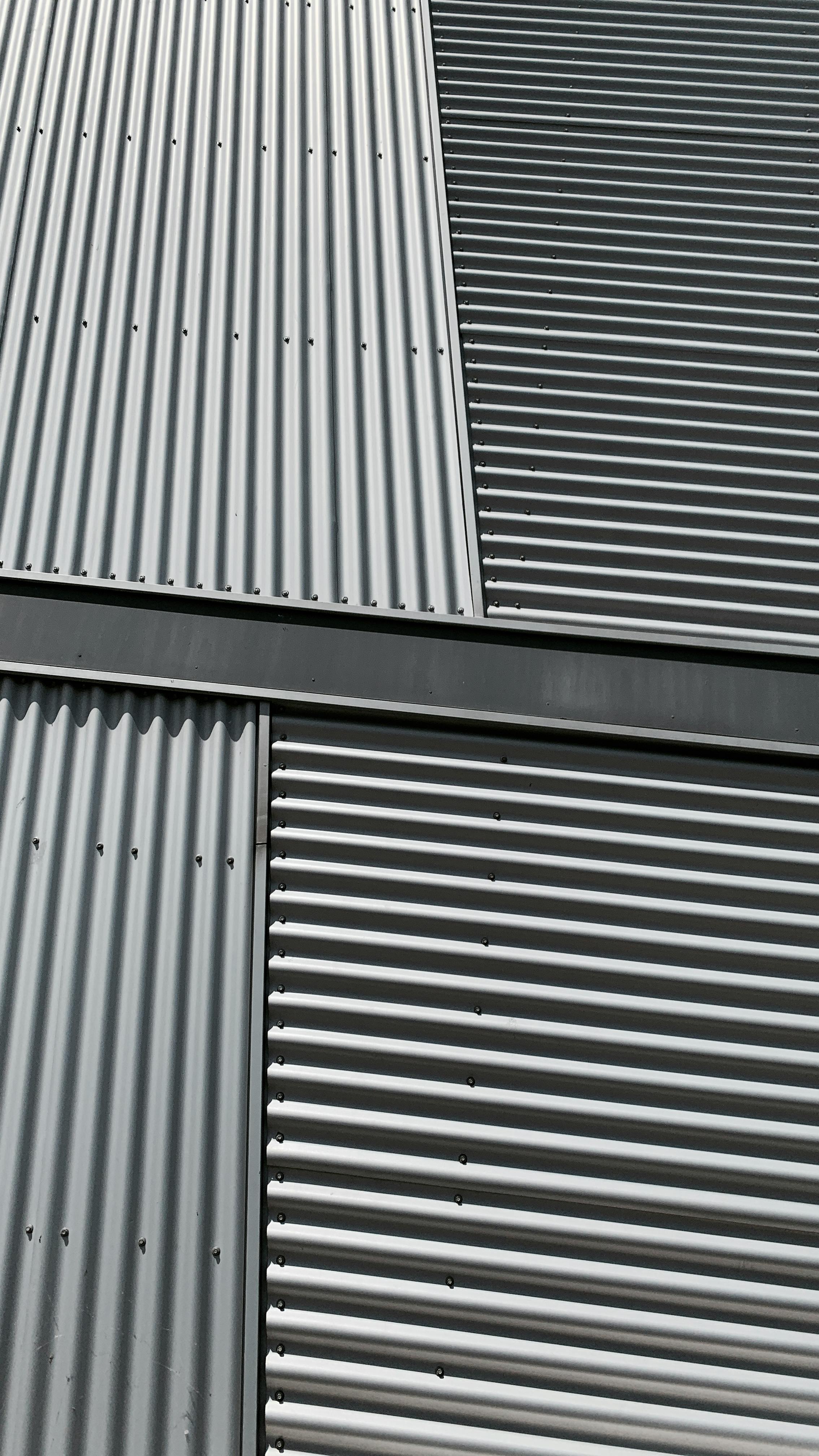 A Gray Metal Wall · Free Stock Photo