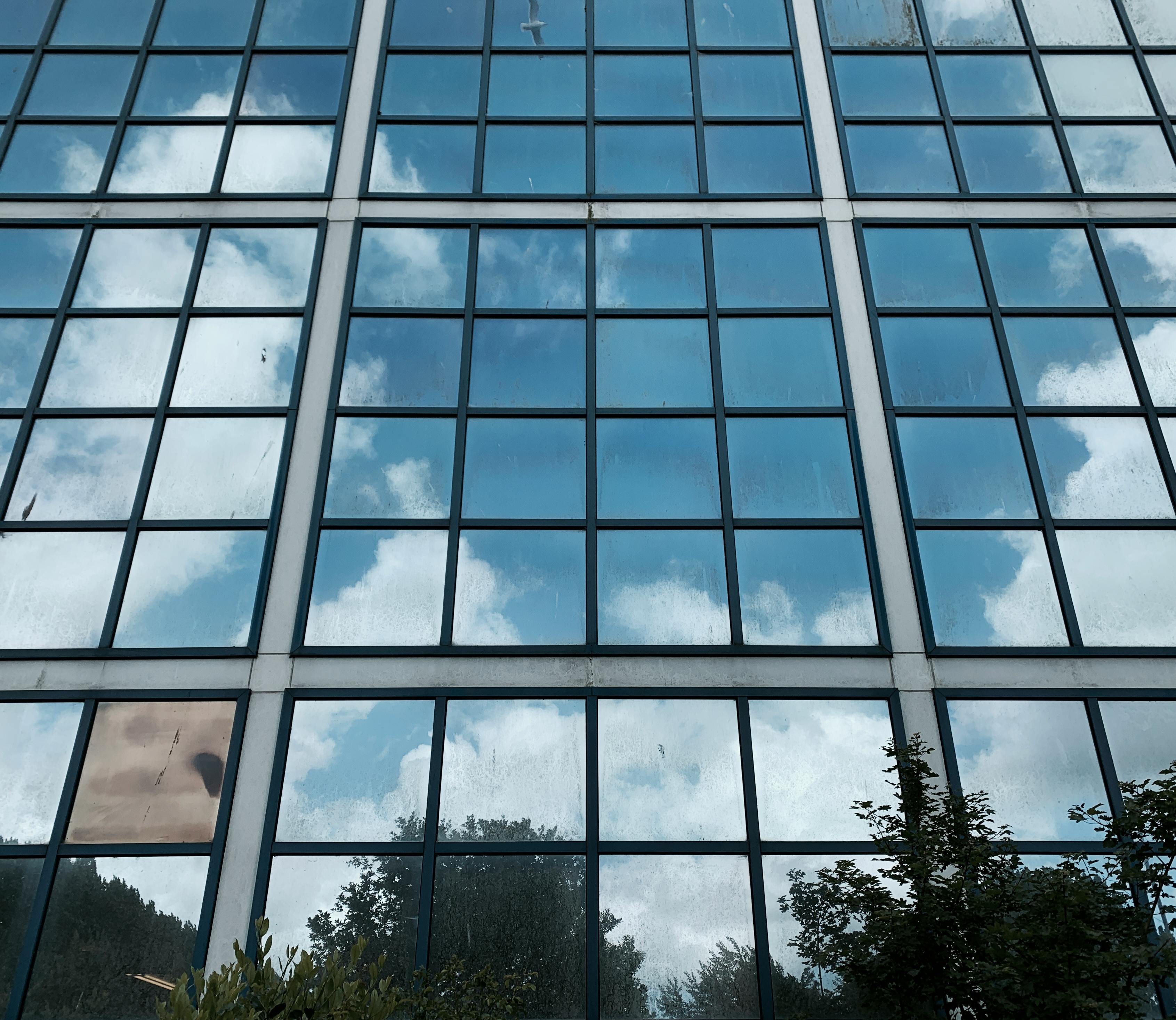 Mirror of Building Showing Opened Window · Free Stock Photo