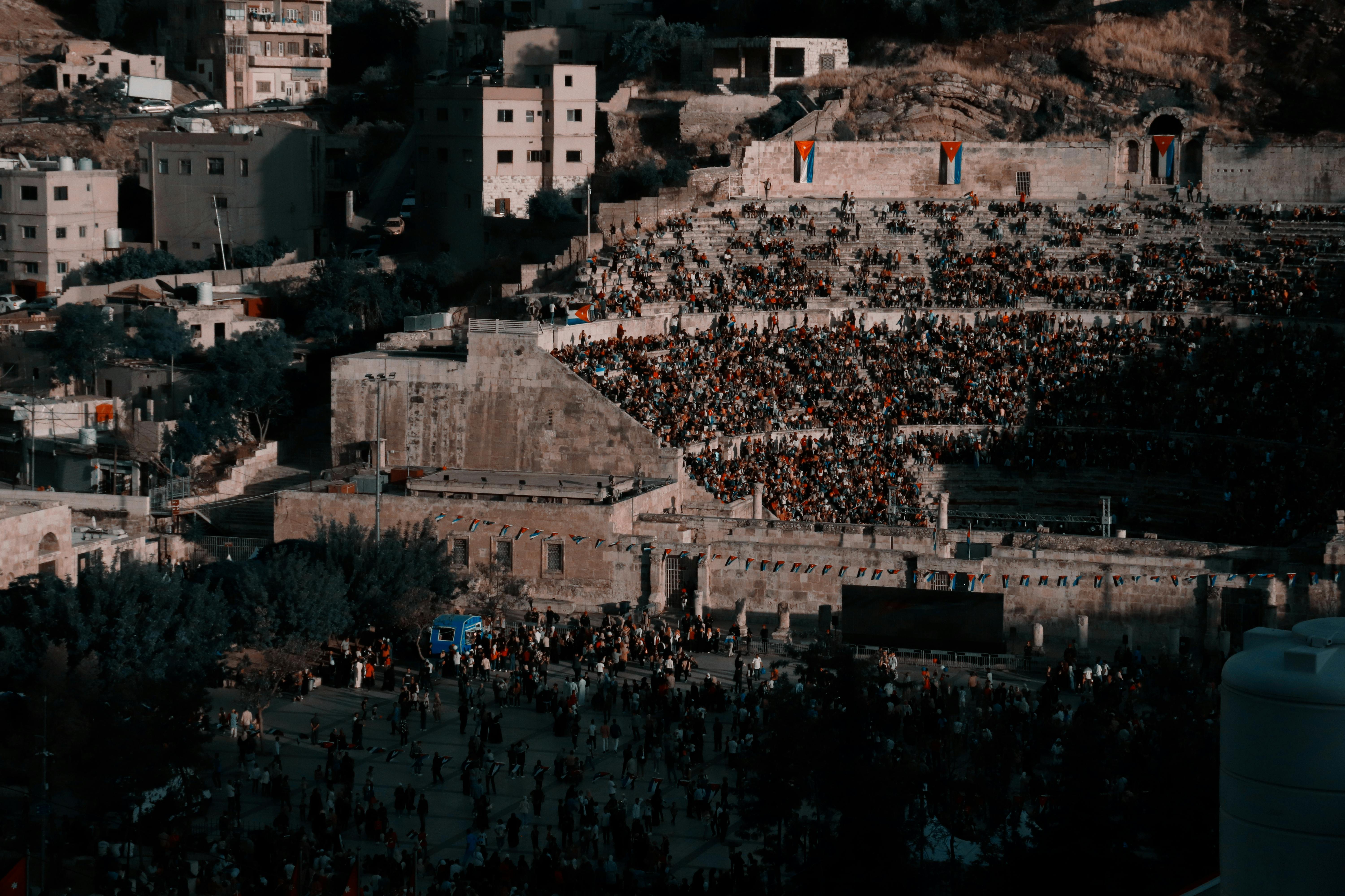 People at the Roman Theatre in Hawari Shar Park · Free Stock Photo
