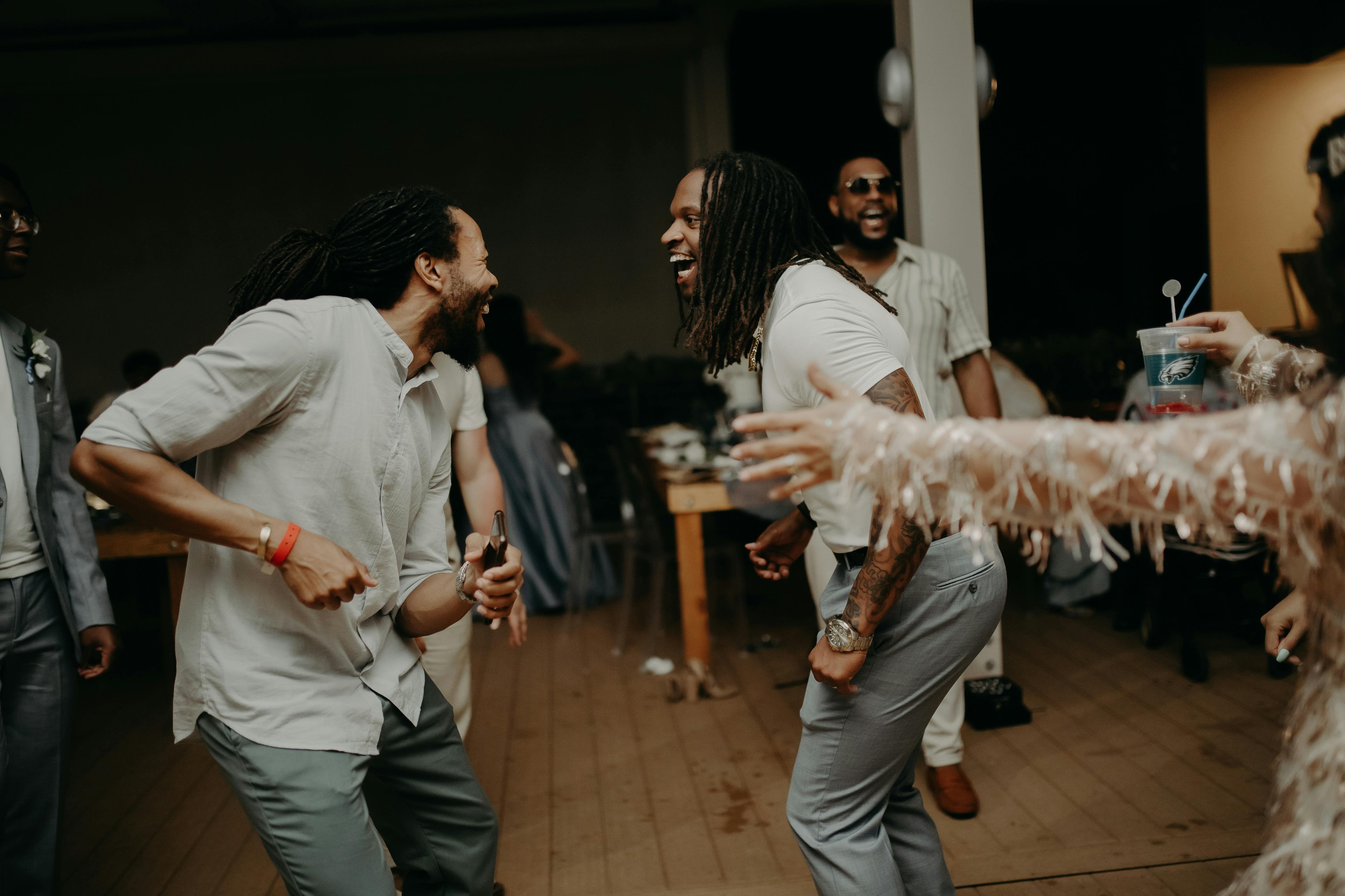 Happy Men Dancing Together · Free Stock Photo