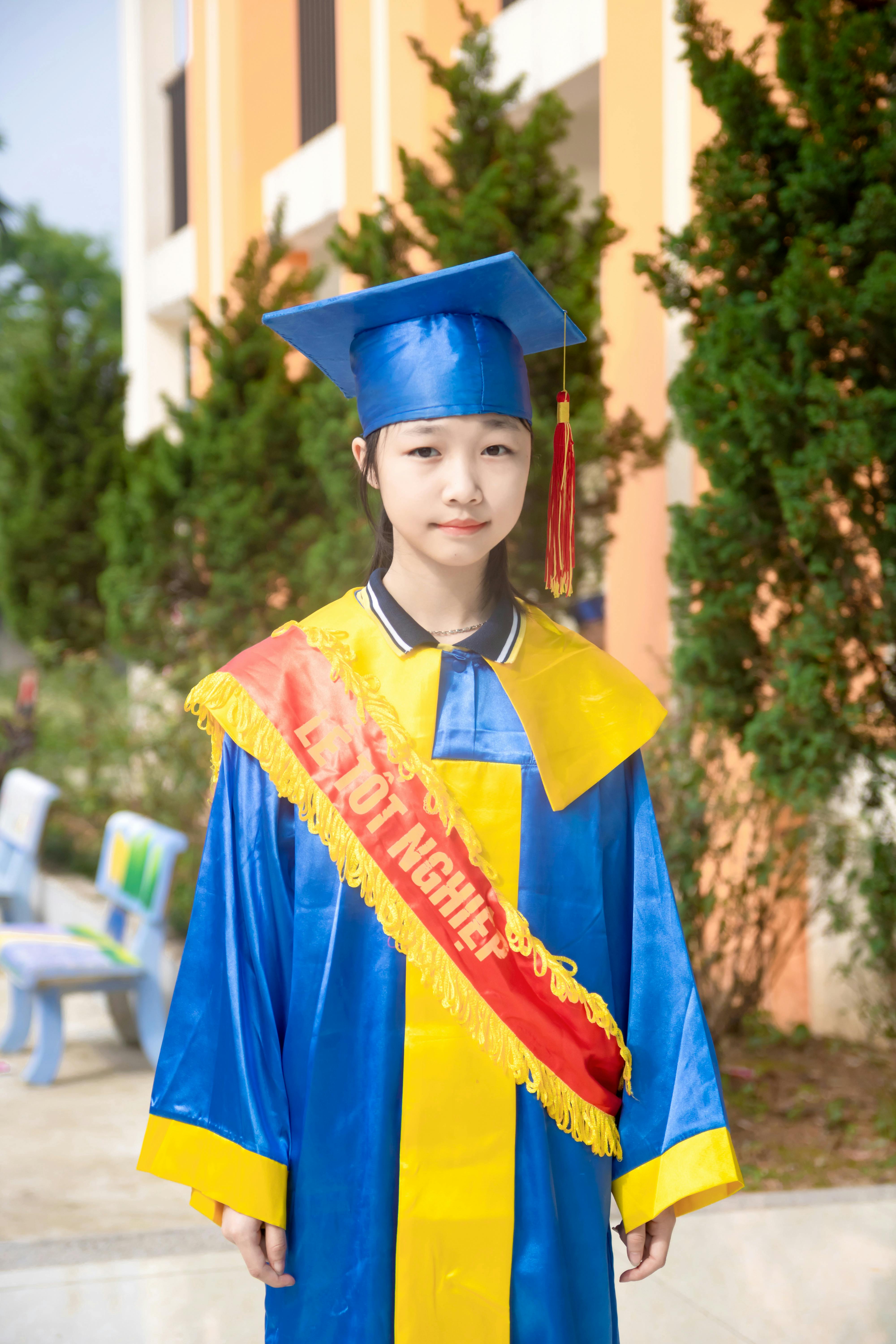 Children Wearing White Academic Gown during Graduation Ceremony at ...
