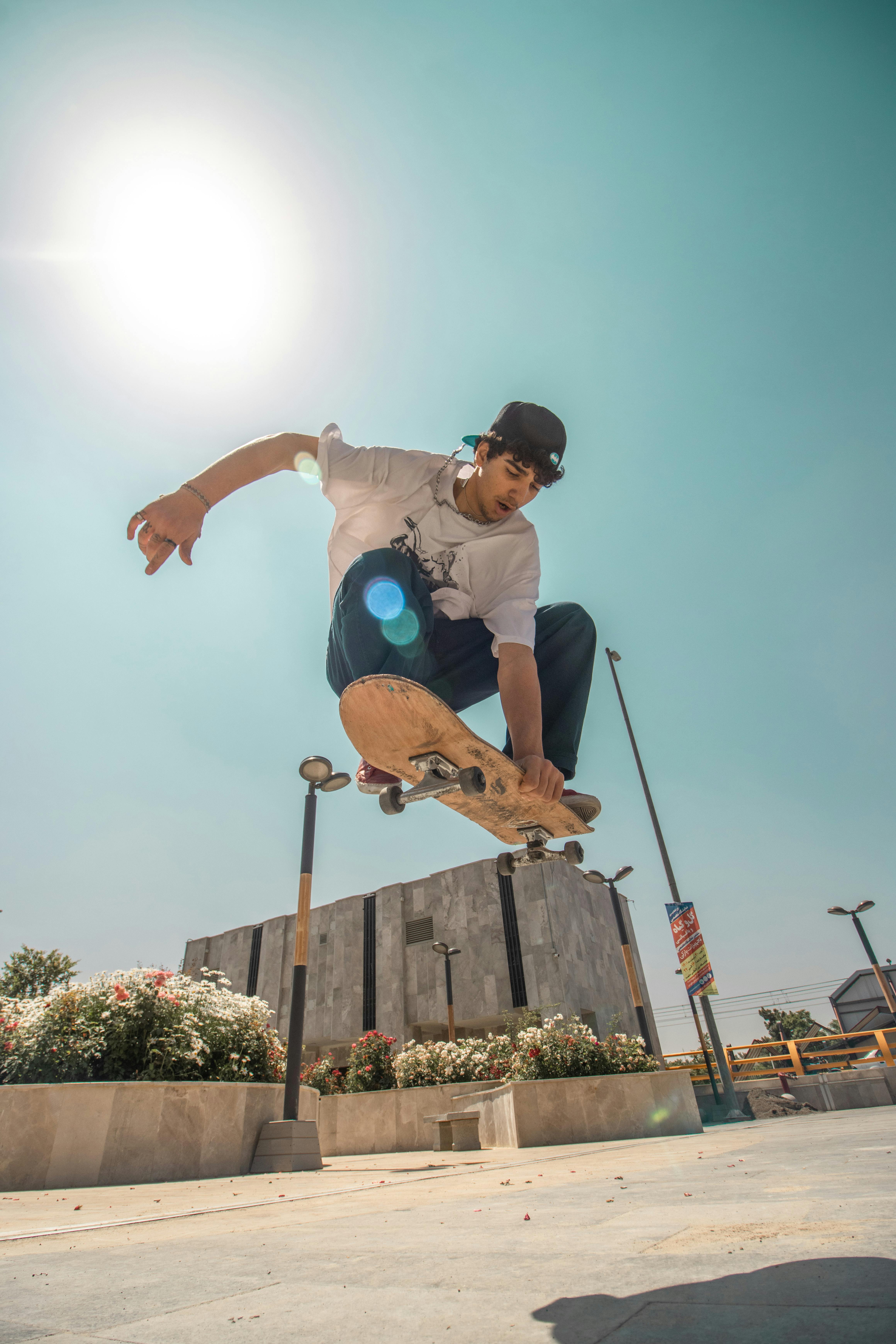 A Shirtless Man Skateboarding · Free Stock Photo
