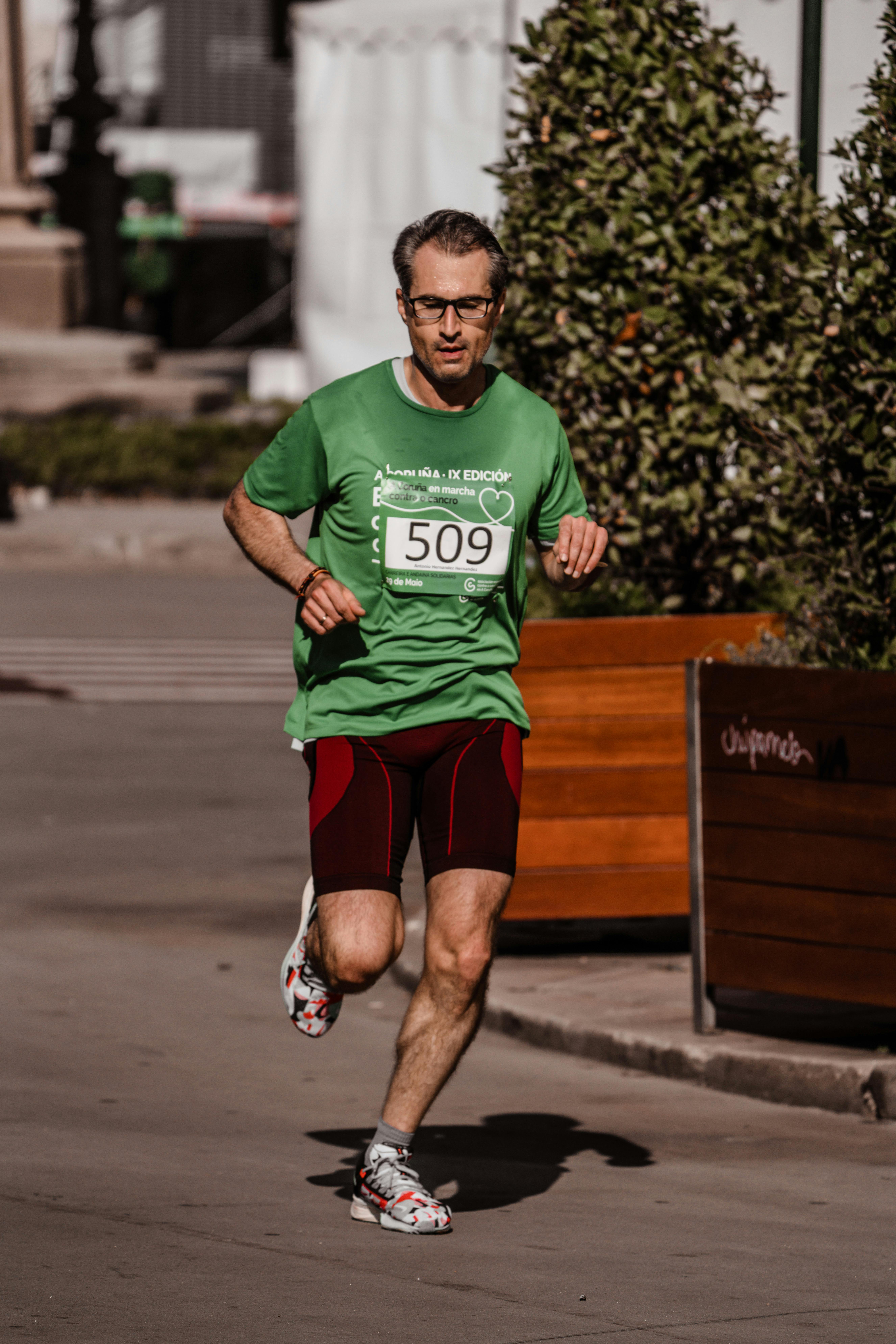 A Man in Green Shirt Running · Free Stock Photo