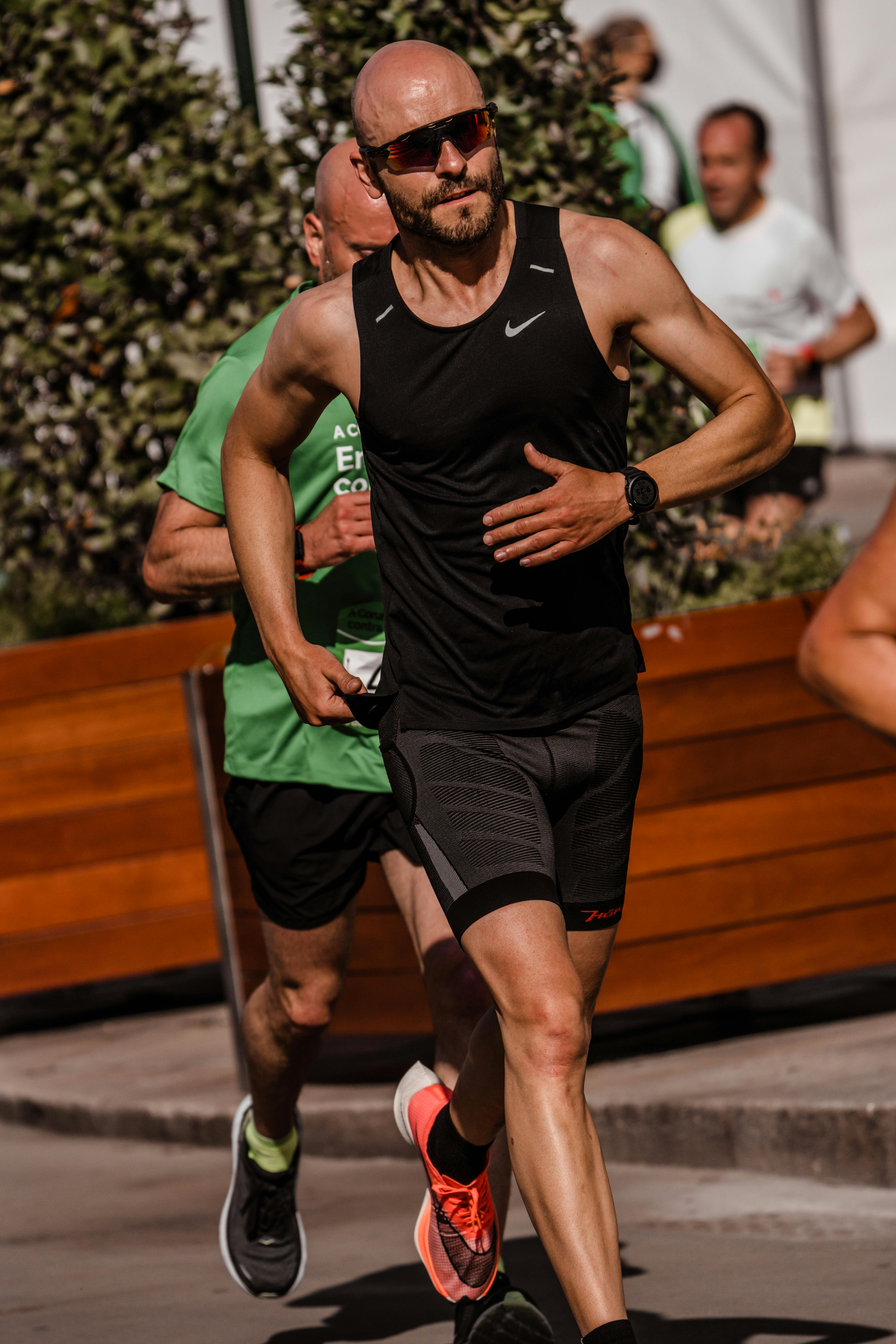 A Man in Black Tank Top Running · Free Stock Photo