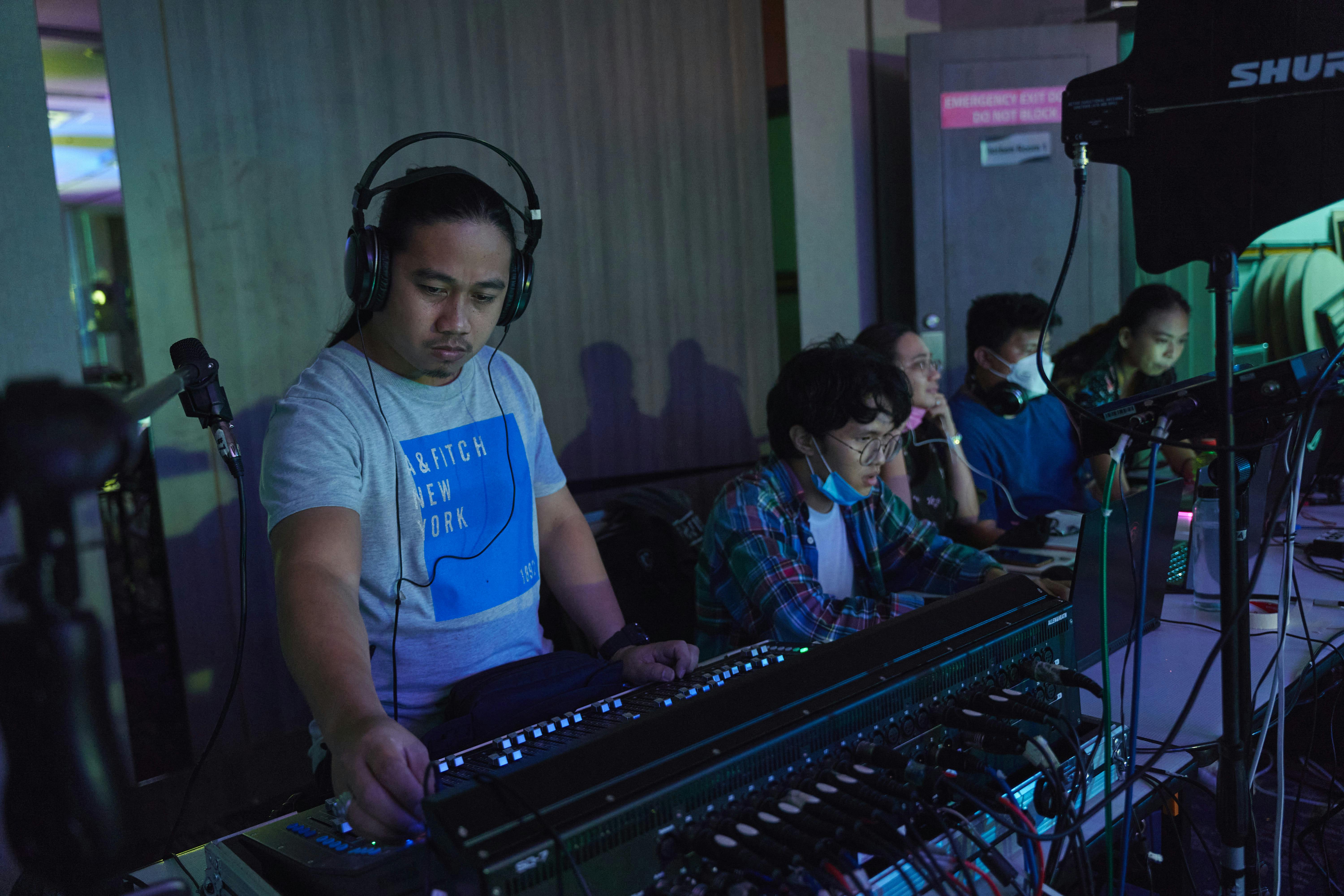 Hand on a Broadcasting Mixer · Free Stock Photo