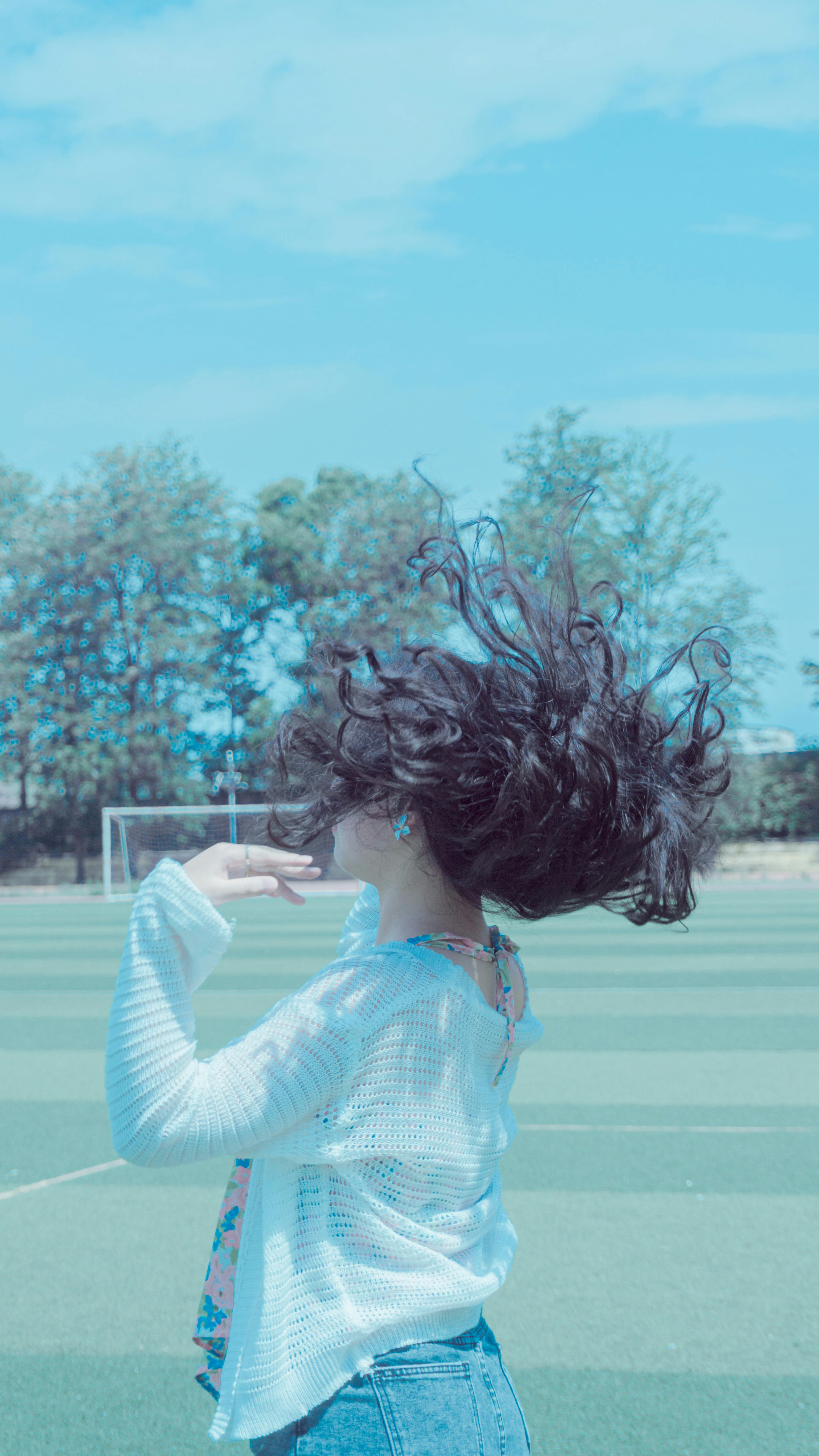 Woman Throwing her Hair Back · Free Stock Photo