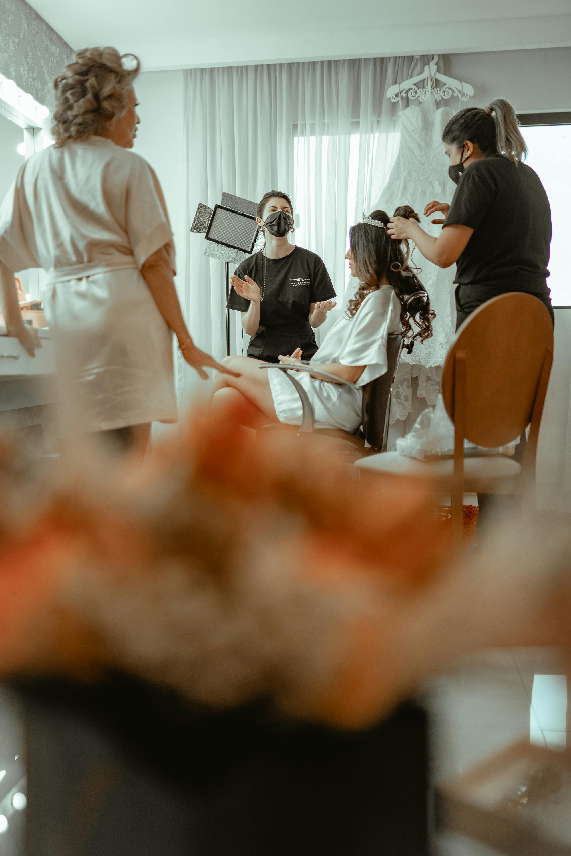 Stylists Fixing Womens Hair · Free Stock Photo