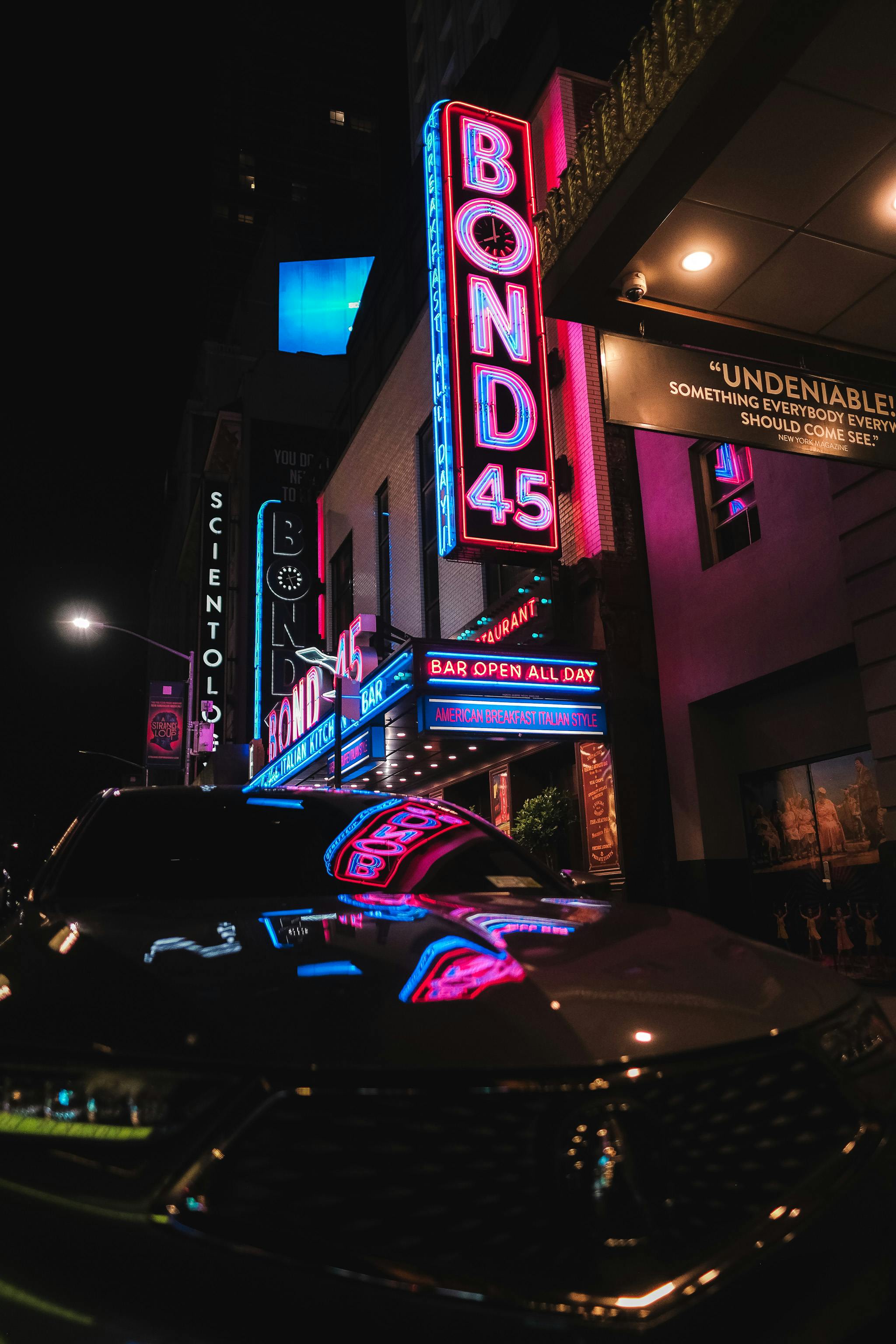 Illuminated Signage of a Commercial Building · Free Stock Photo