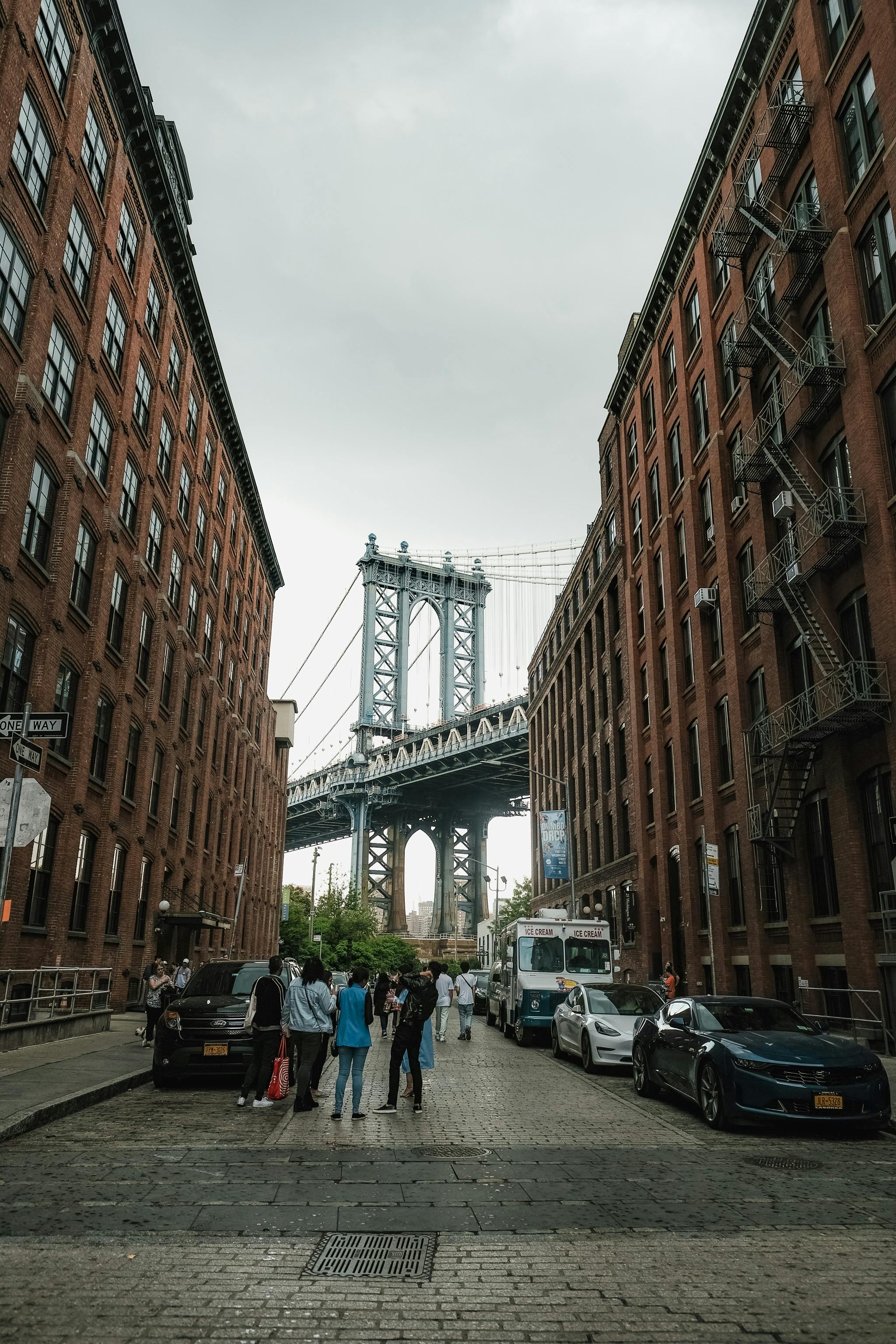 View on Brooklyn Bridge Between Buildings · Free Stock Photo