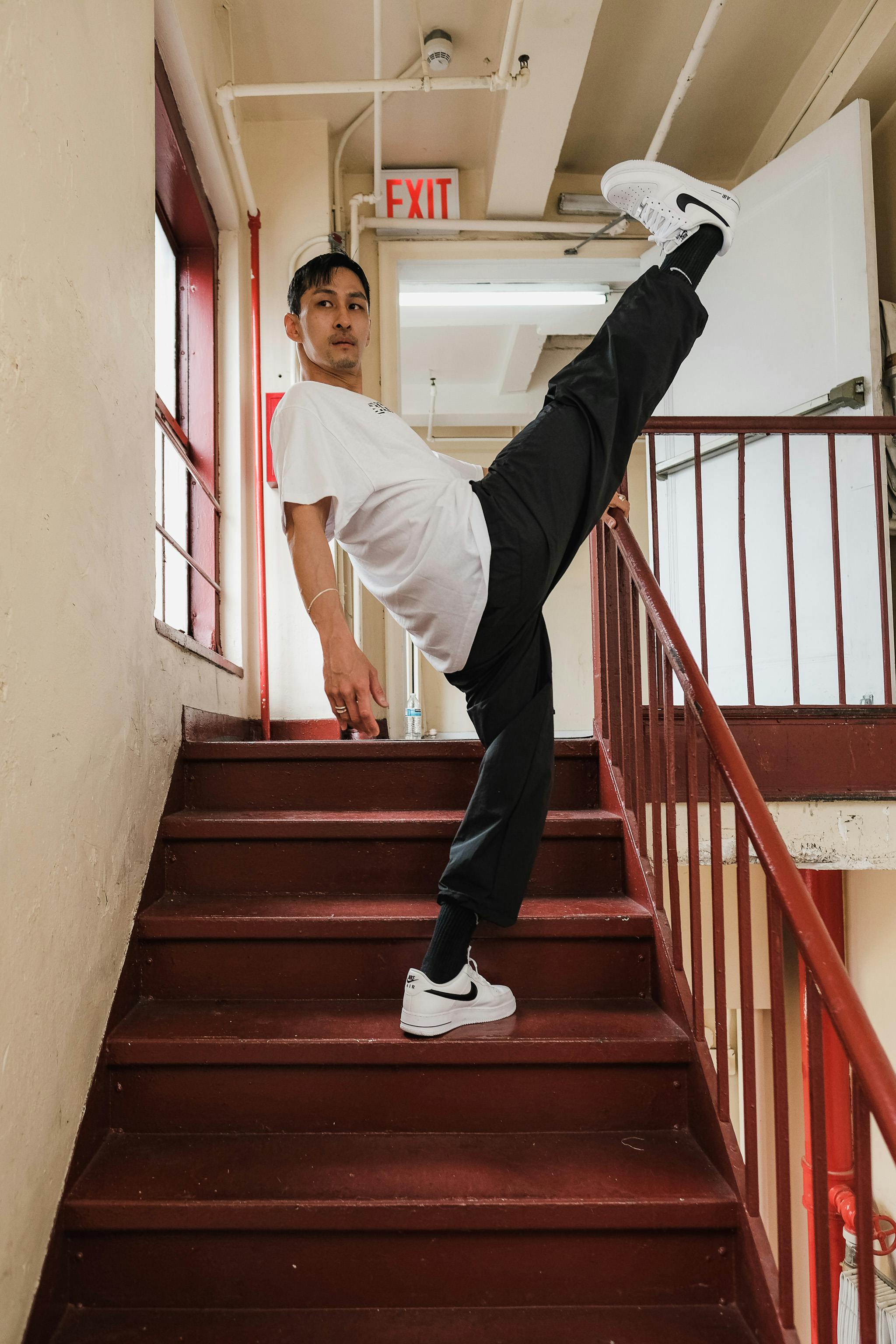 A Man Posing on a Staircase · Free Stock Photo