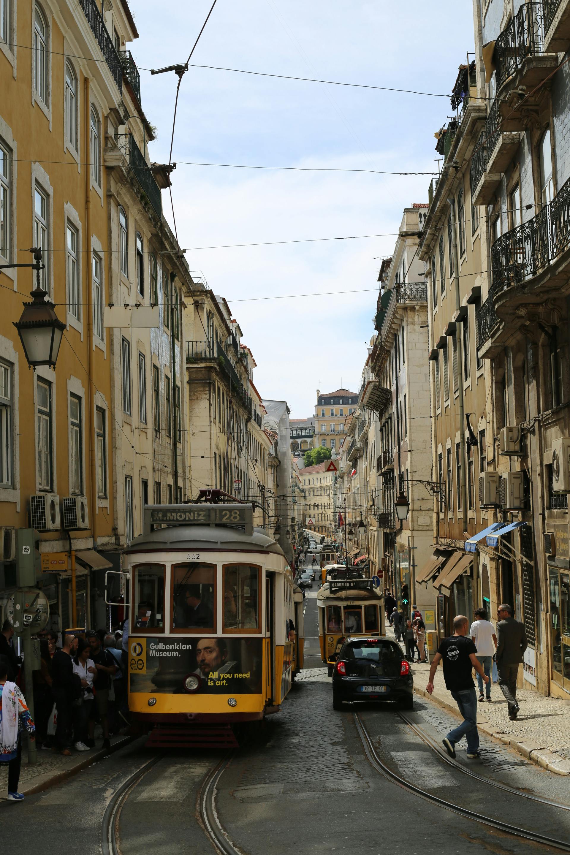 Narrow City Street with a Trams · Free Stock Photo