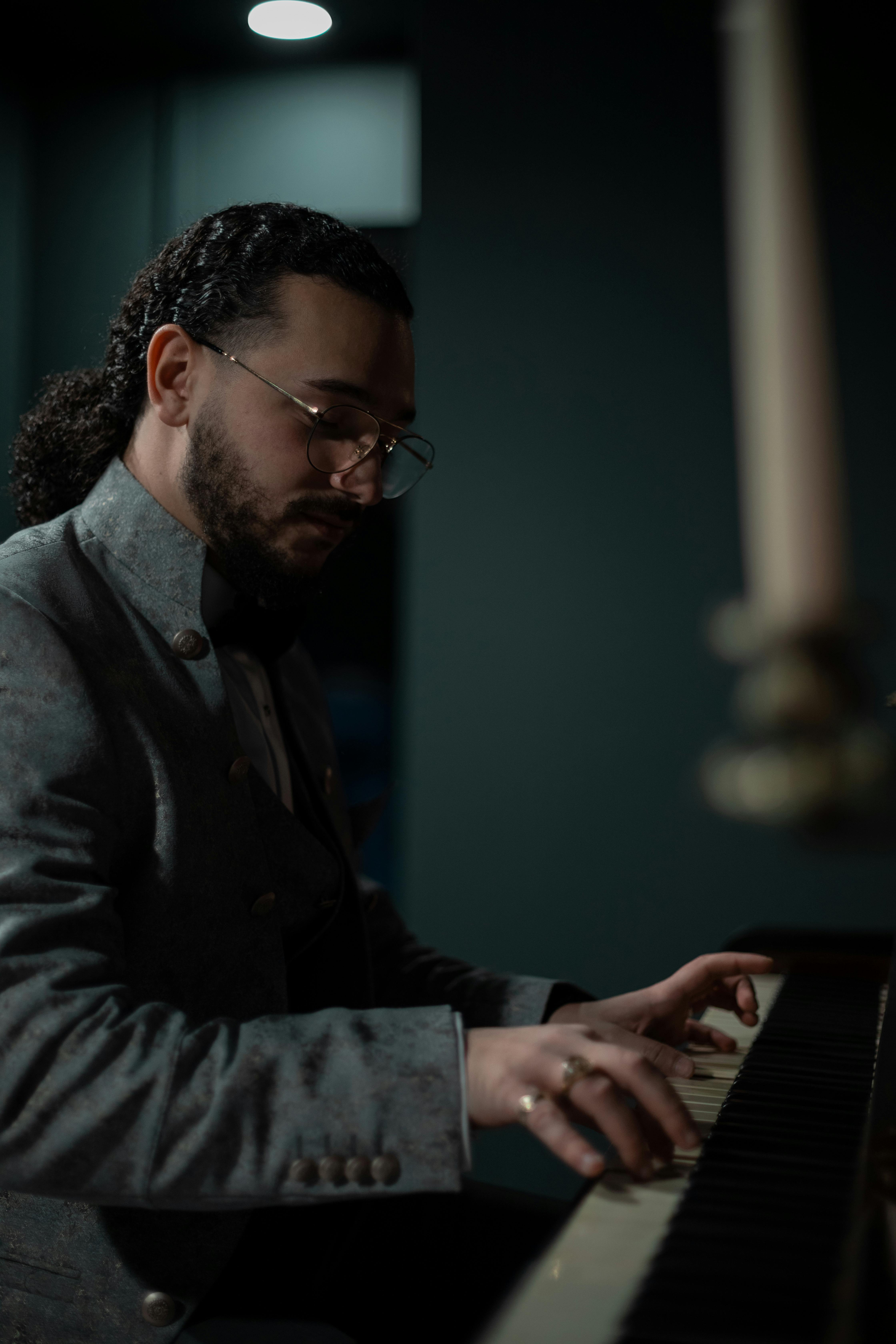 A Man Playing on an Electronic Keyboard · Free Stock Photo
