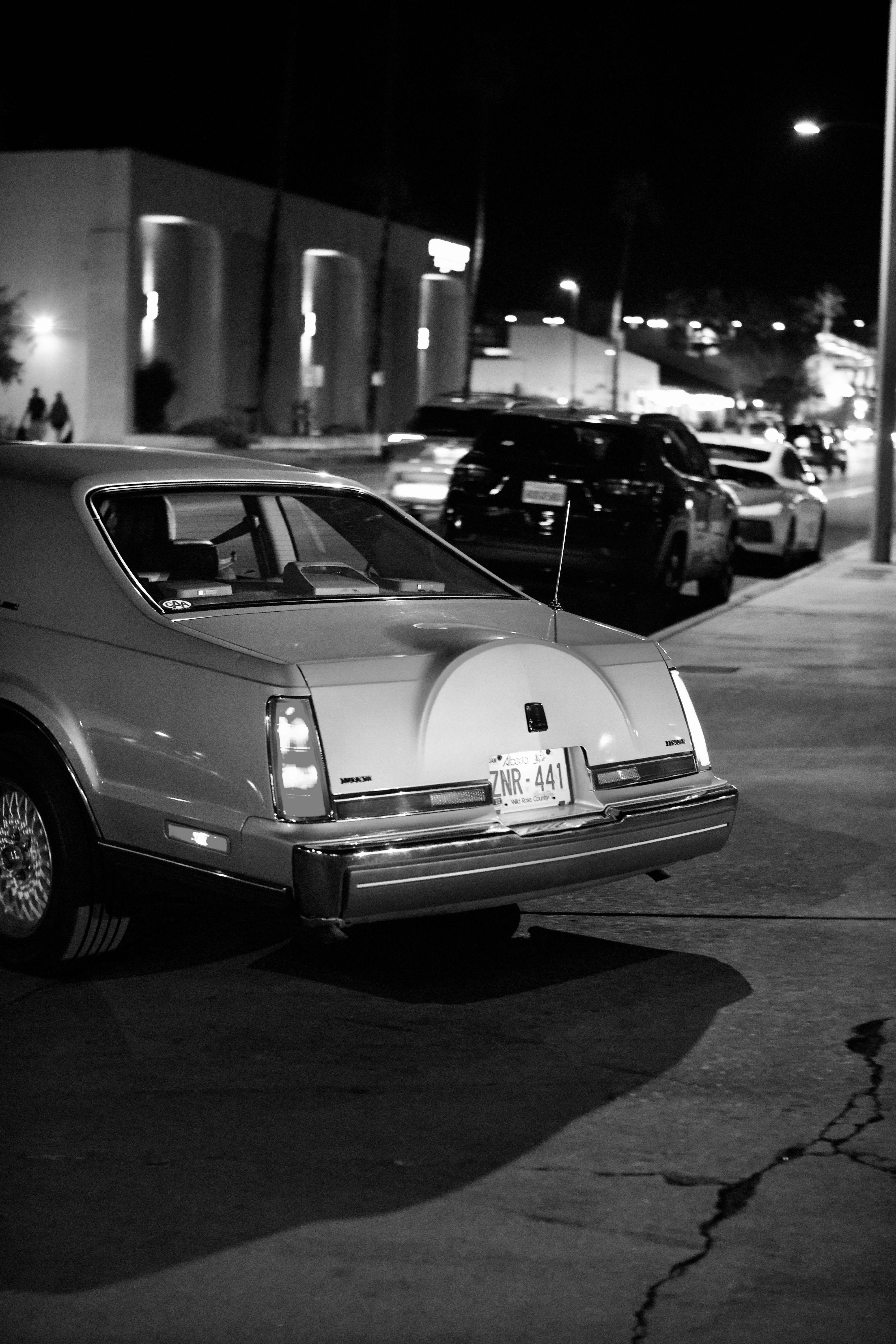 Grayscale Photo of Parked Cars · Free Stock Photo