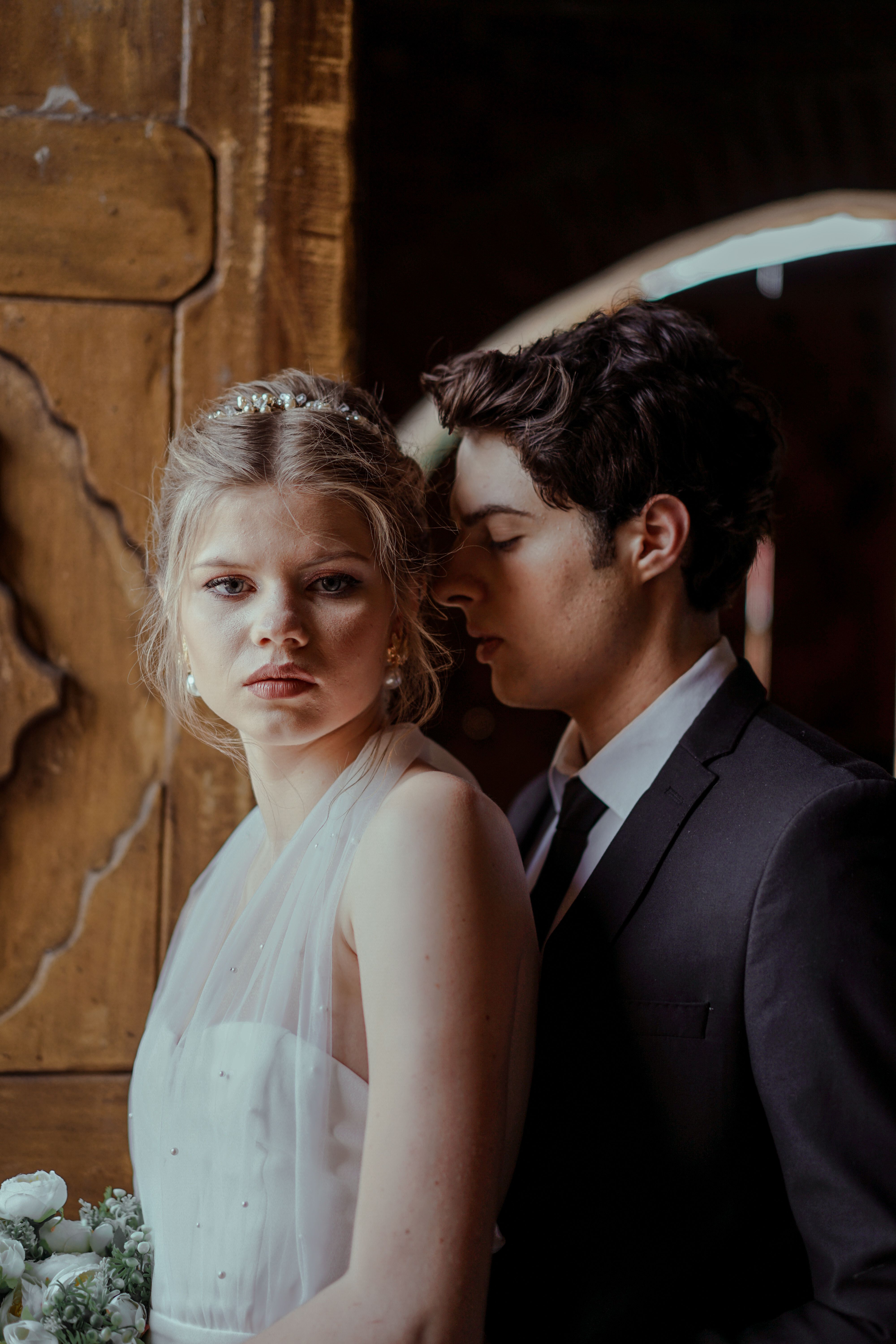 A Groom Standing at the Back of the Bride · Free Stock Photo