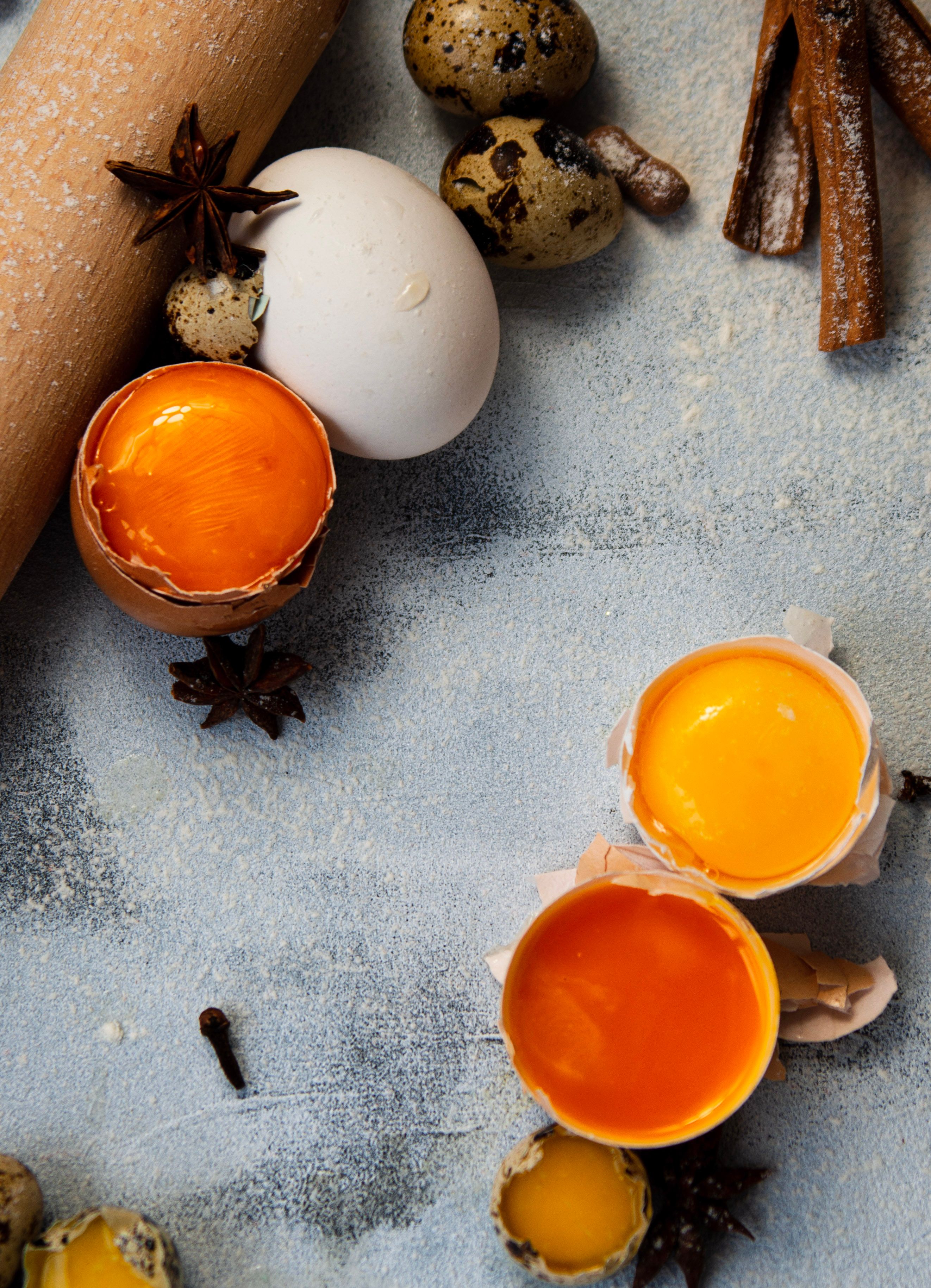 Close-Up Shot of an Egg Yolk on Blue Surface · Free Stock Photo
