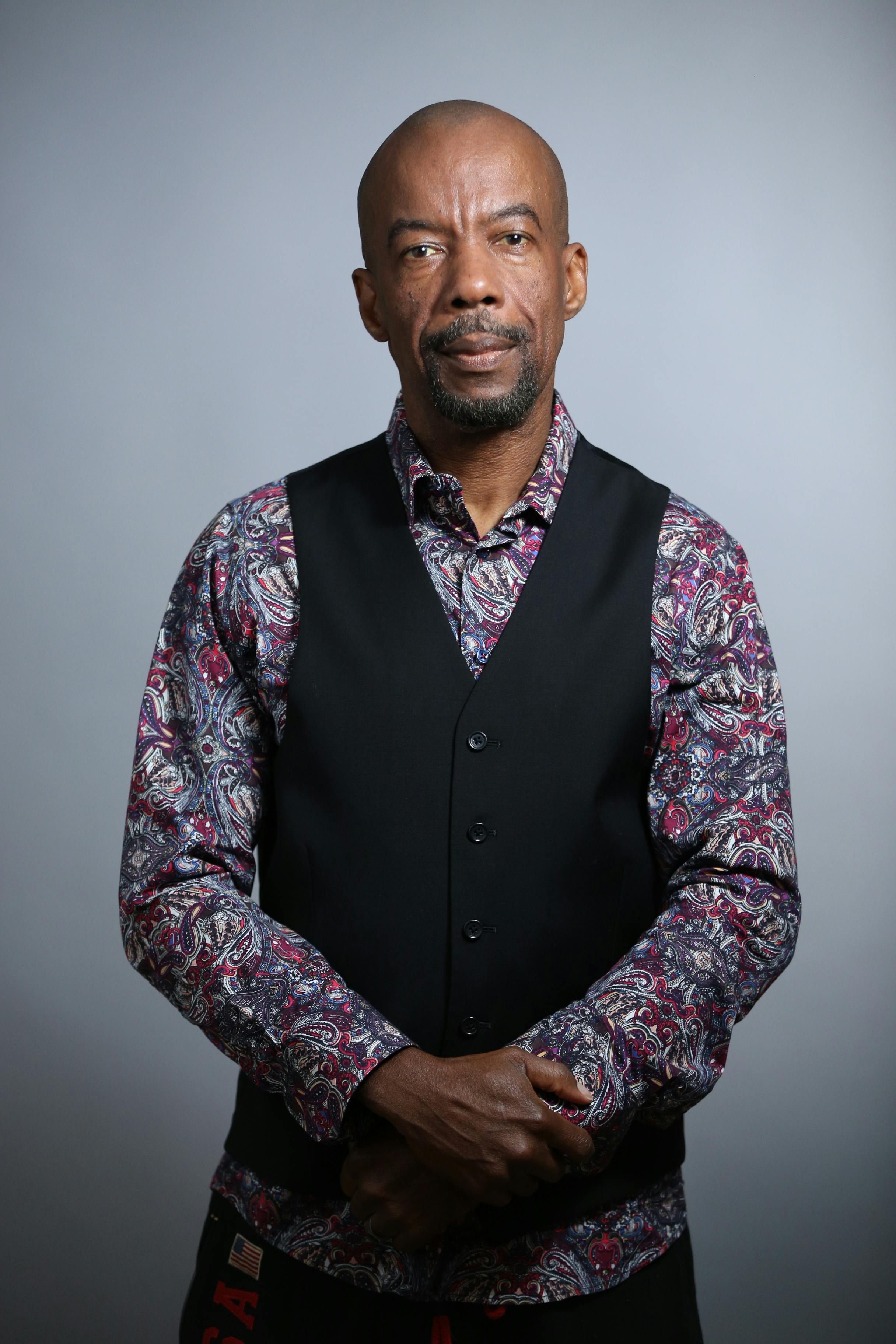 Man in Black and Purple Floral Long Sleeves Smiling · Free Stock Photo