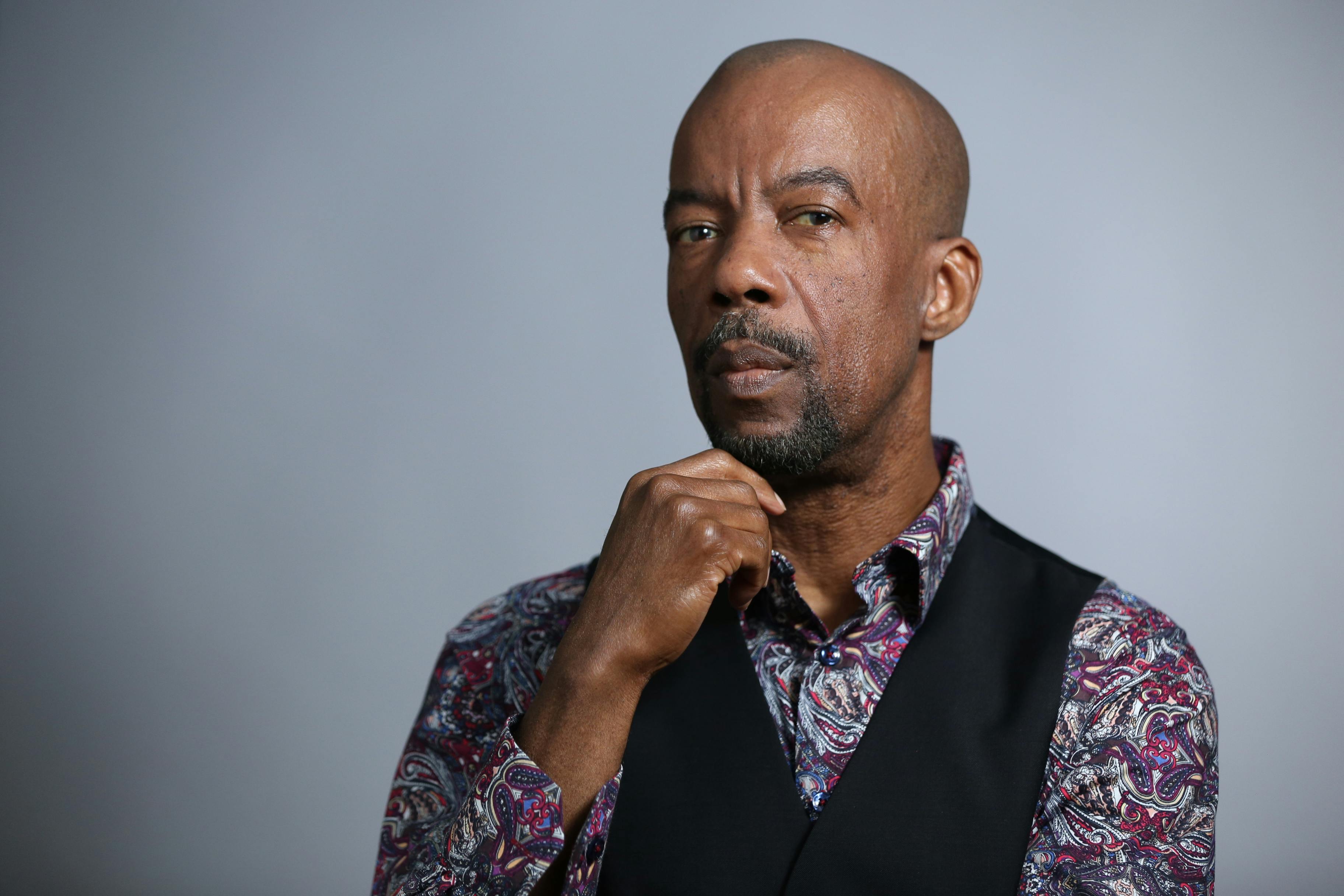 Man in Black and Purple Floral Long Sleeves Smiling · Free Stock Photo