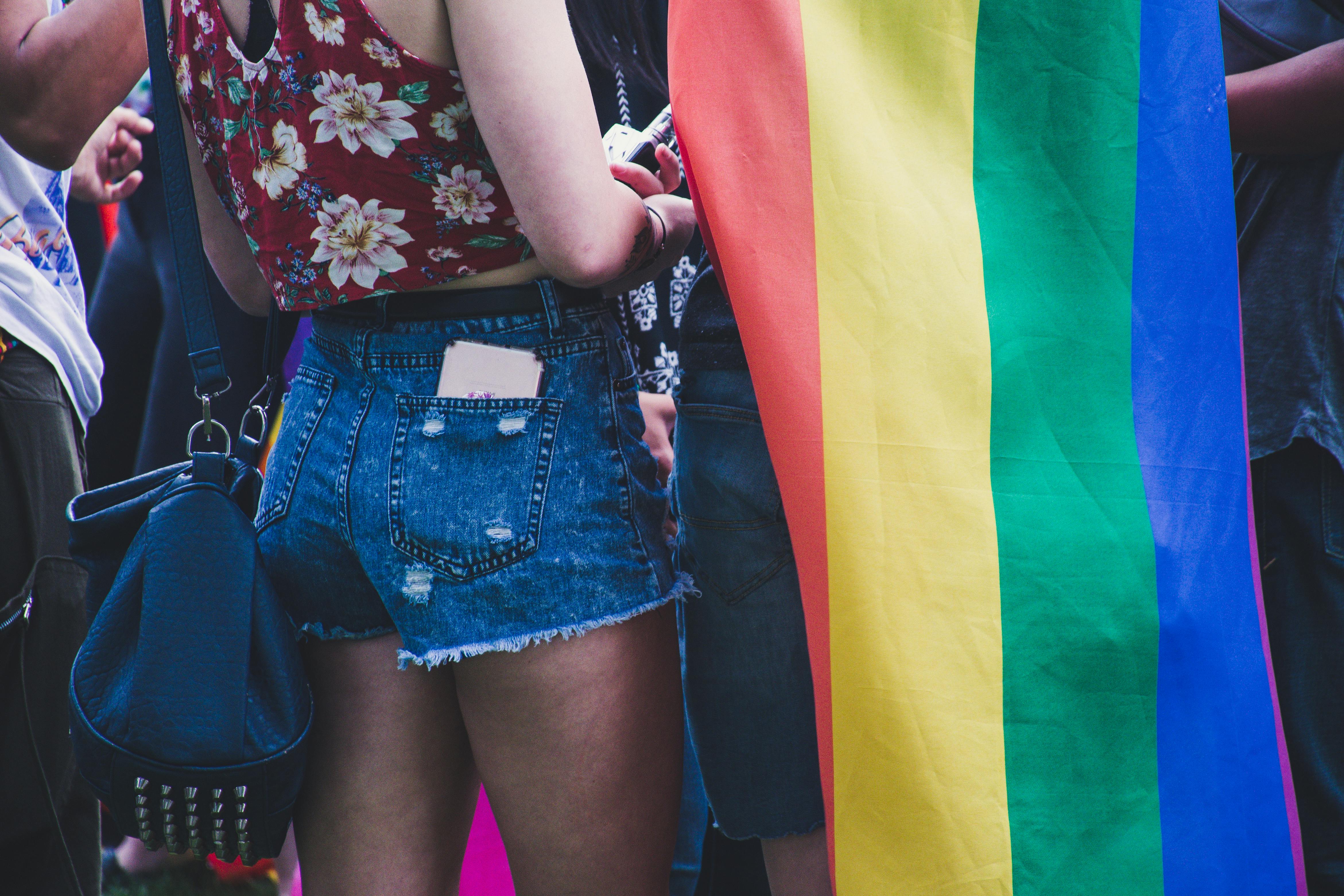 Woman Holding a Gay Pride Flag · Free Stock Photo