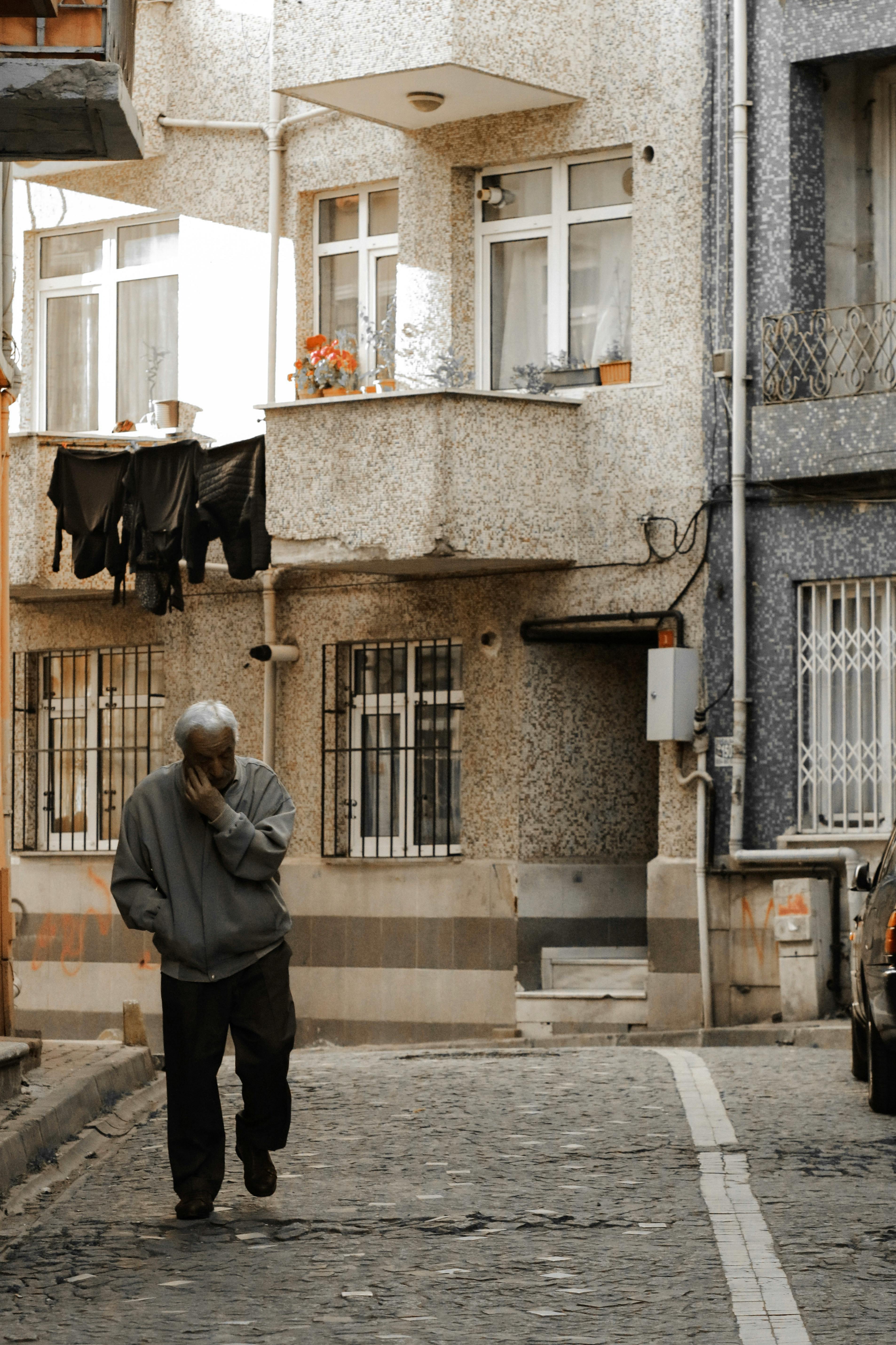 A Man Walking on the Street · Free Stock Photo