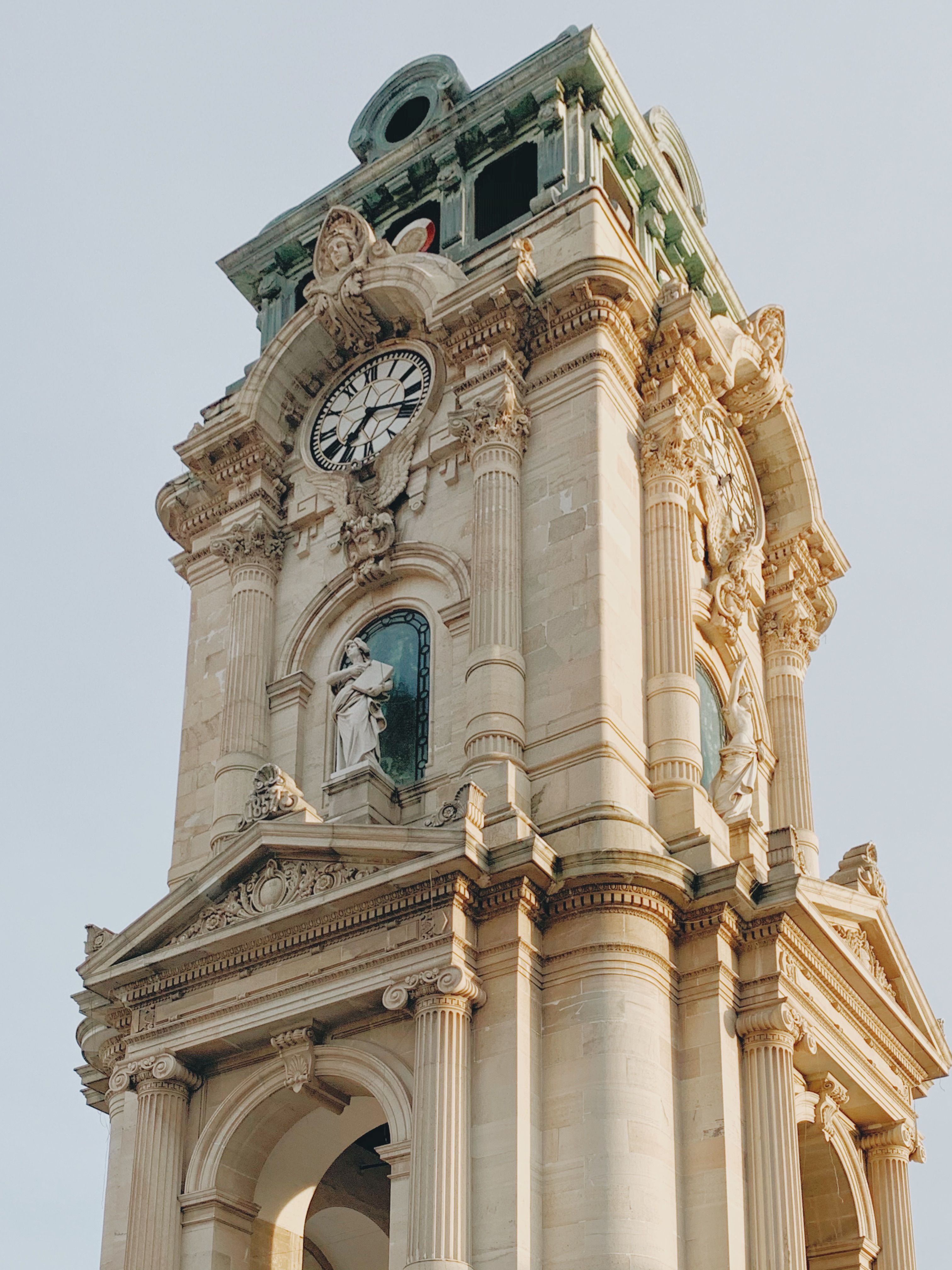 A Clock Tower in Low Angle Shot · Free Stock Photo