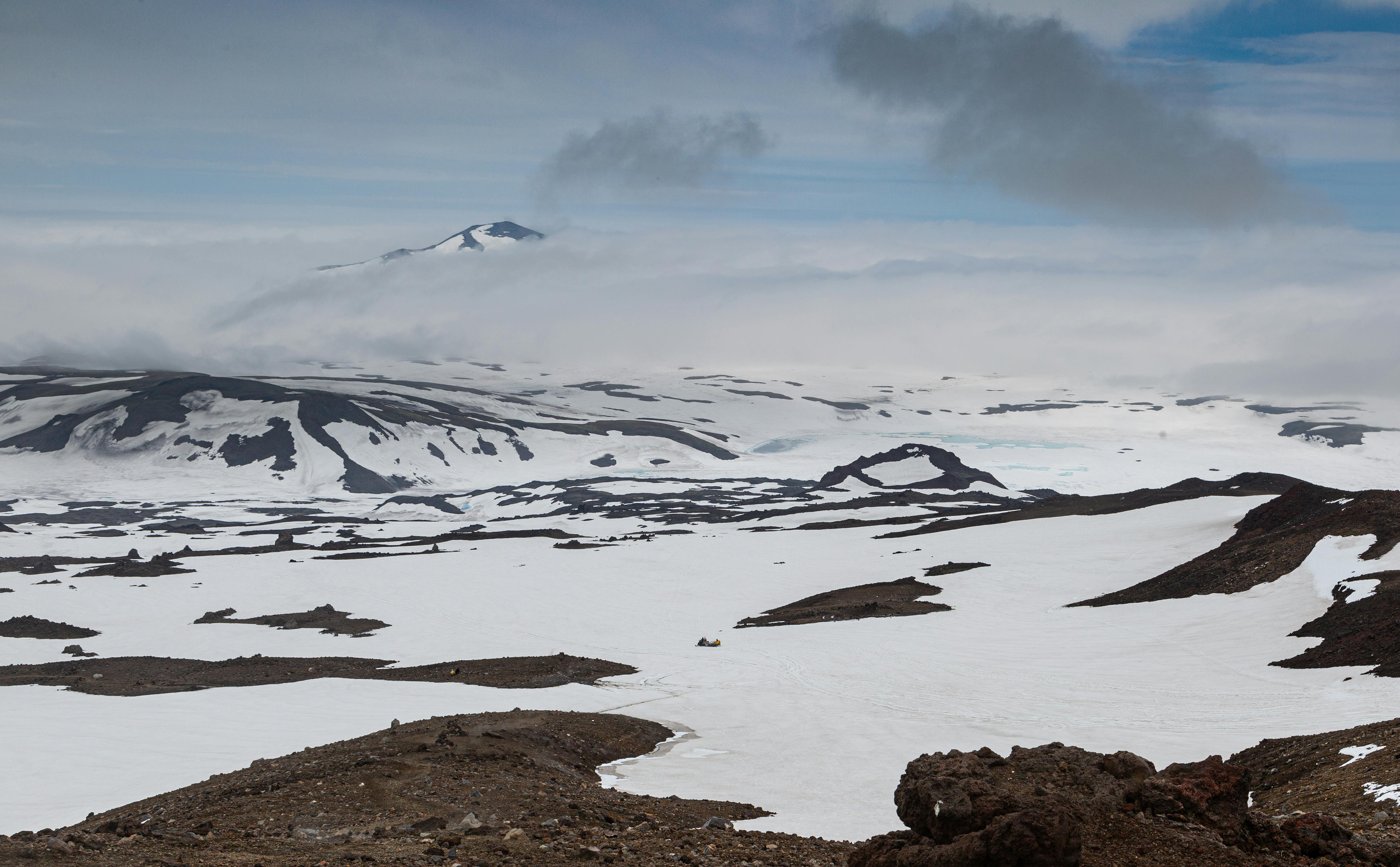 Snowy Mountains and a Volcano in the Horizon · Free Stock Photo