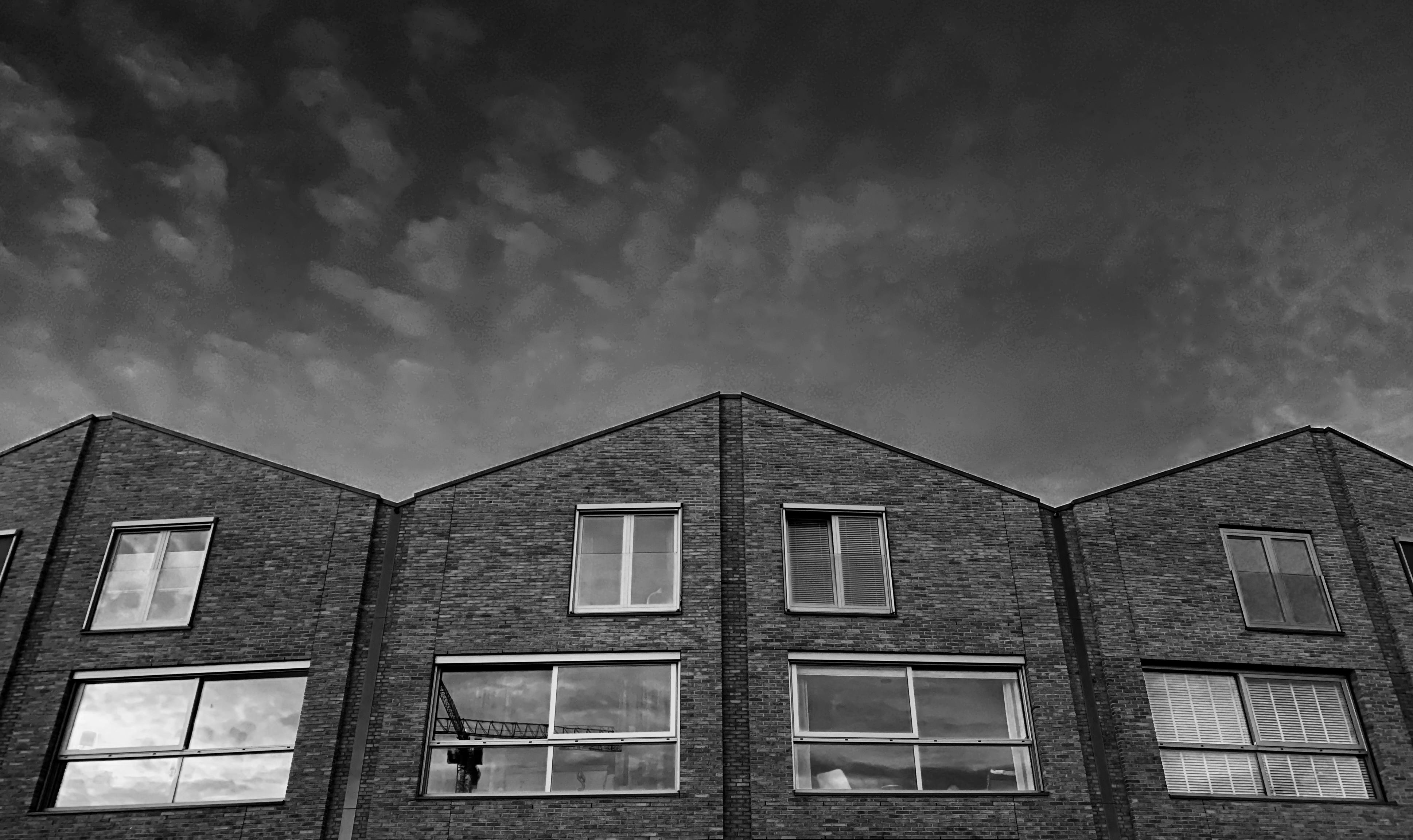 Black and White Low Angle Shot of Terrace Houses · Free Stock Photo