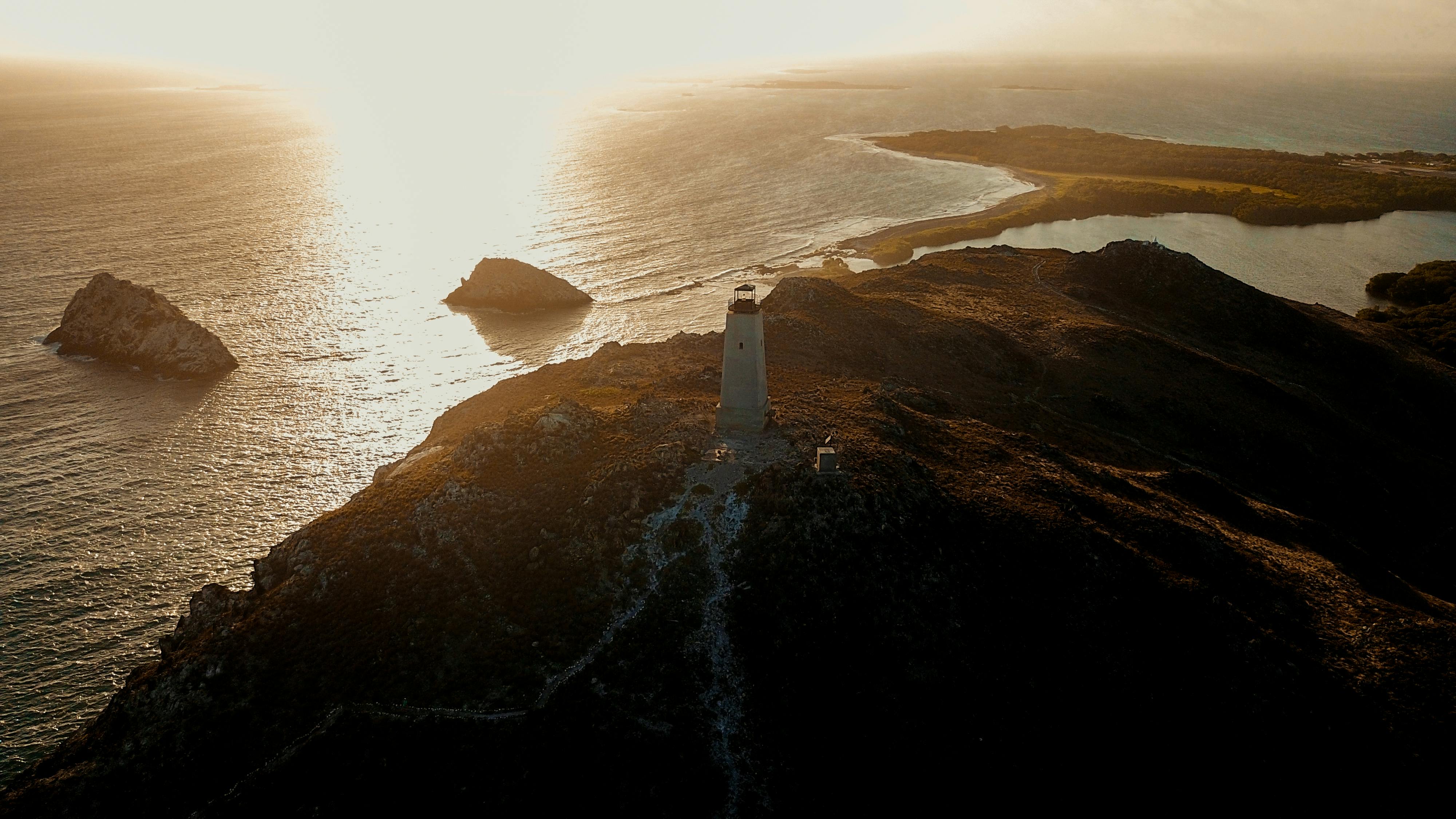 Aerial View of a Lighthouse on a Cliff · Free Stock Photo