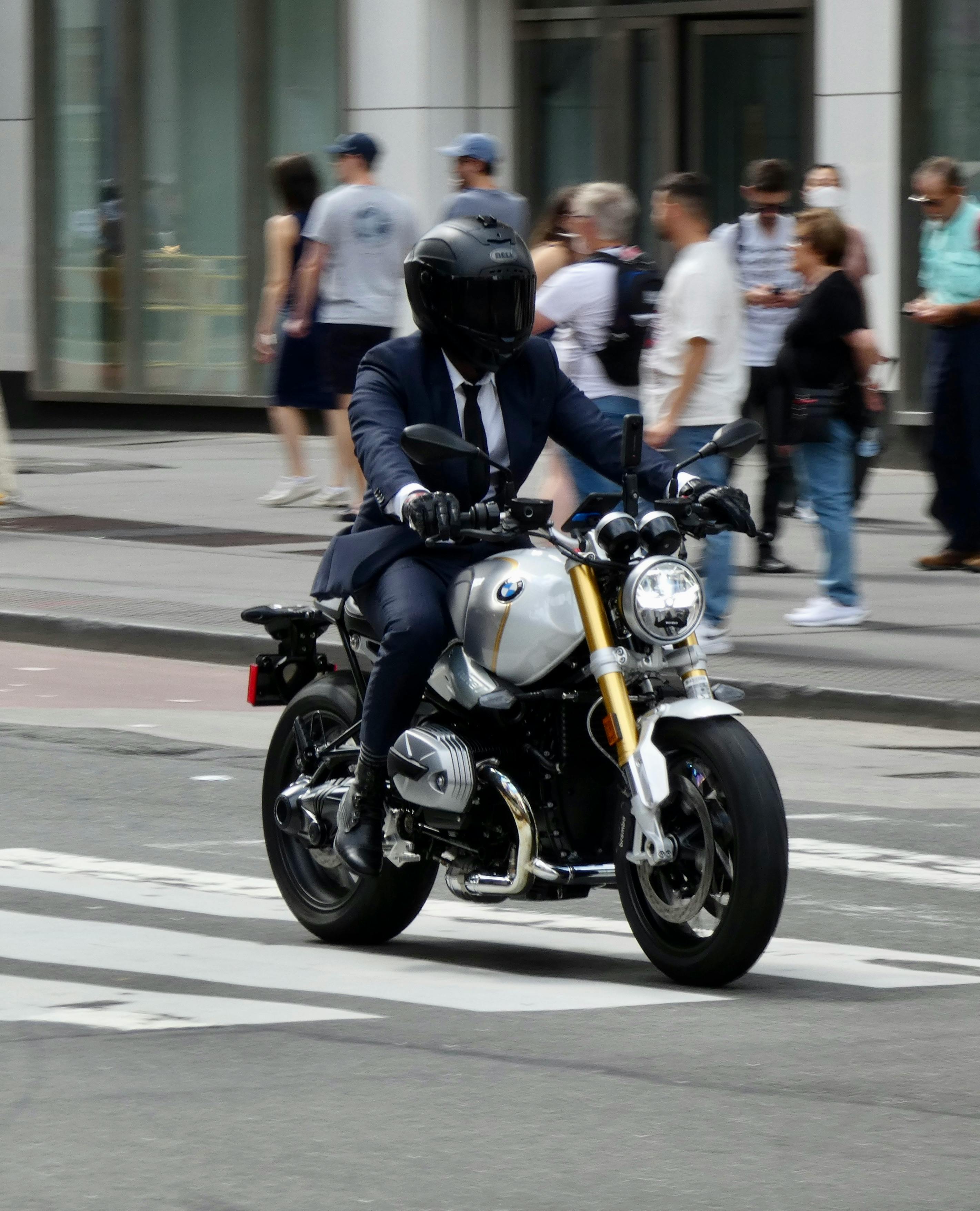 Man in Black Suit Riding a Black Motorcycle · Free Stock Photo