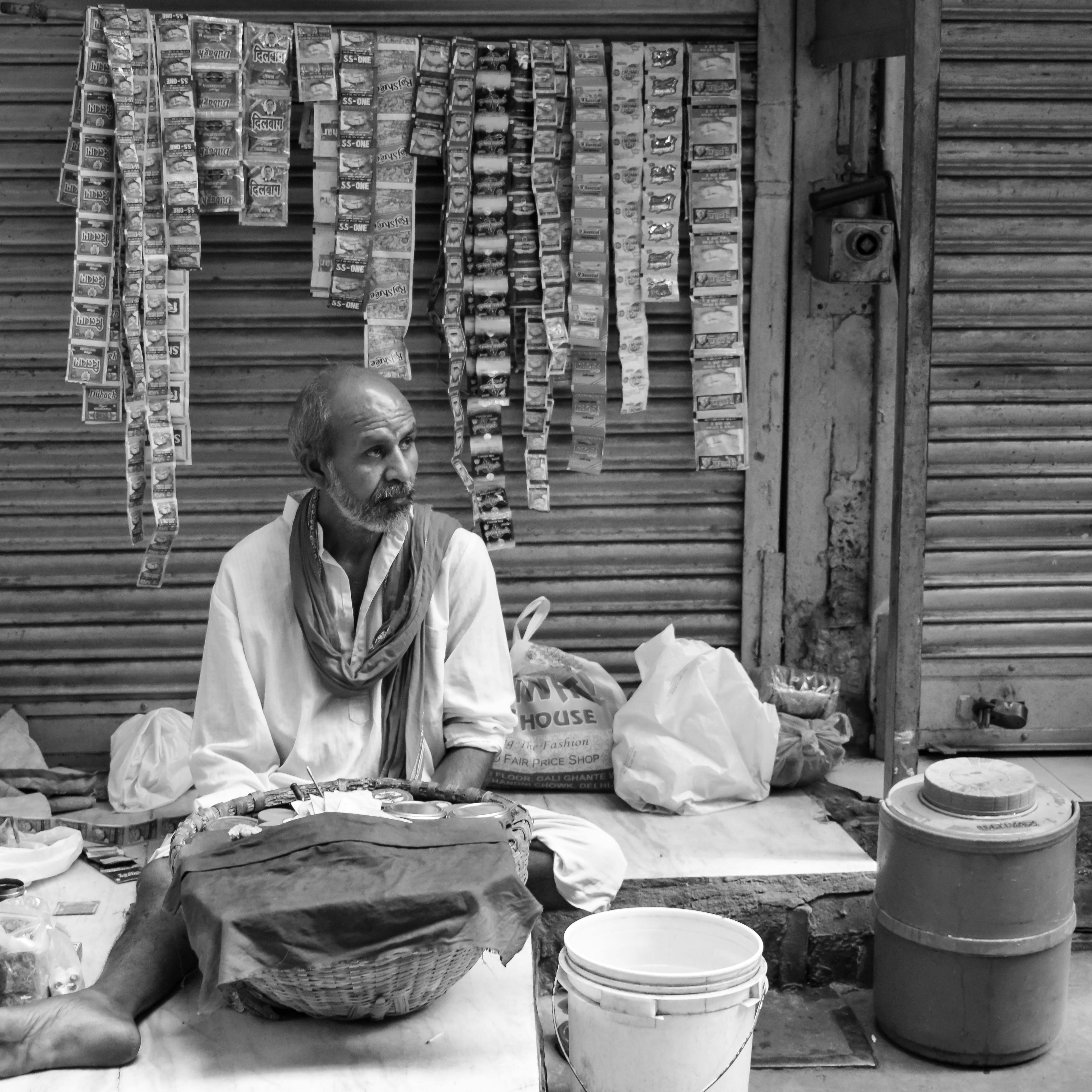 Grayscale Photo of a Man Placing Mushroom in a Plastic Bag · Free Stock ...
