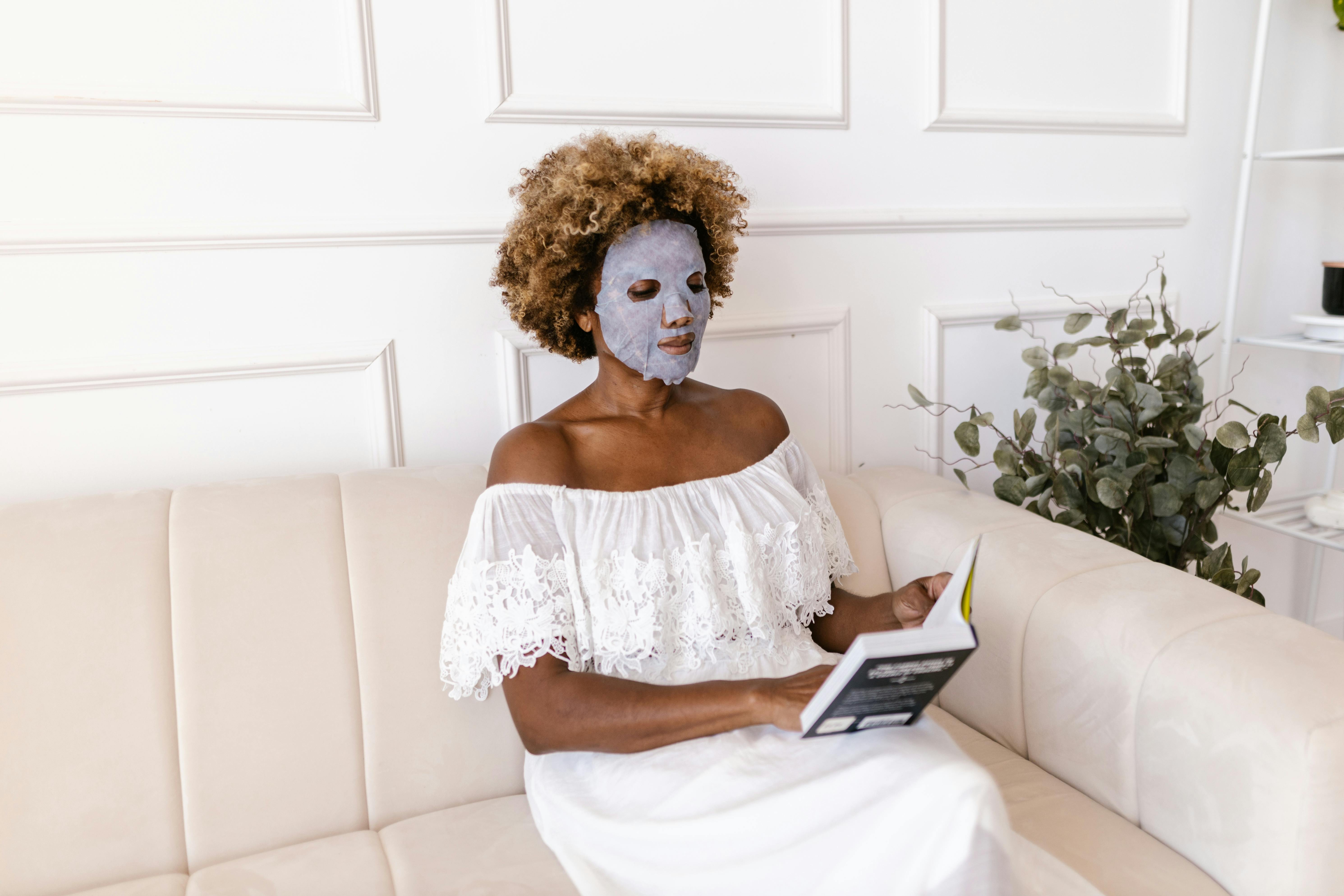 An Open Book on the Person's Face · Free Stock Photo