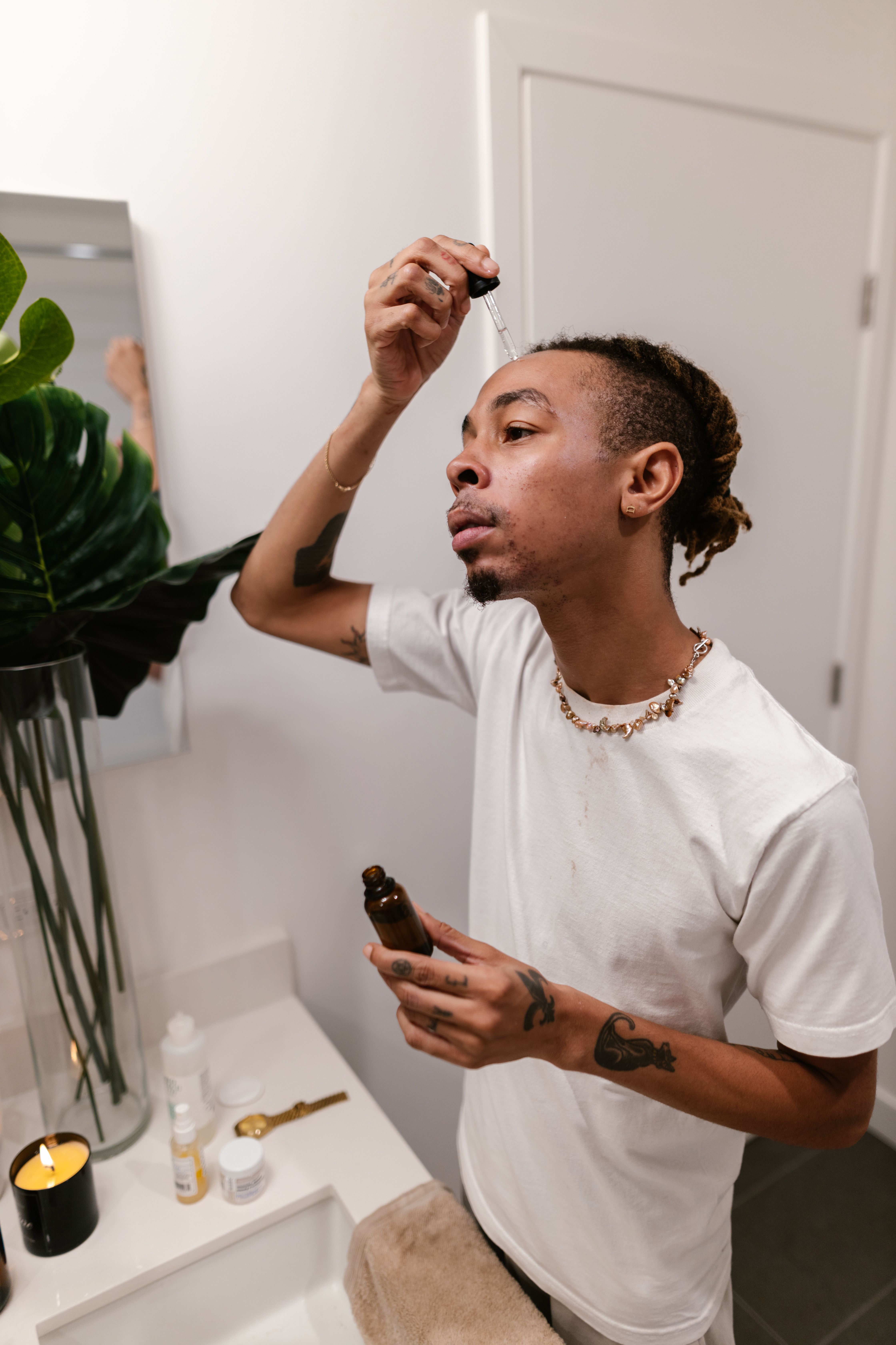 Man Applying Serum · Free Stock Photo