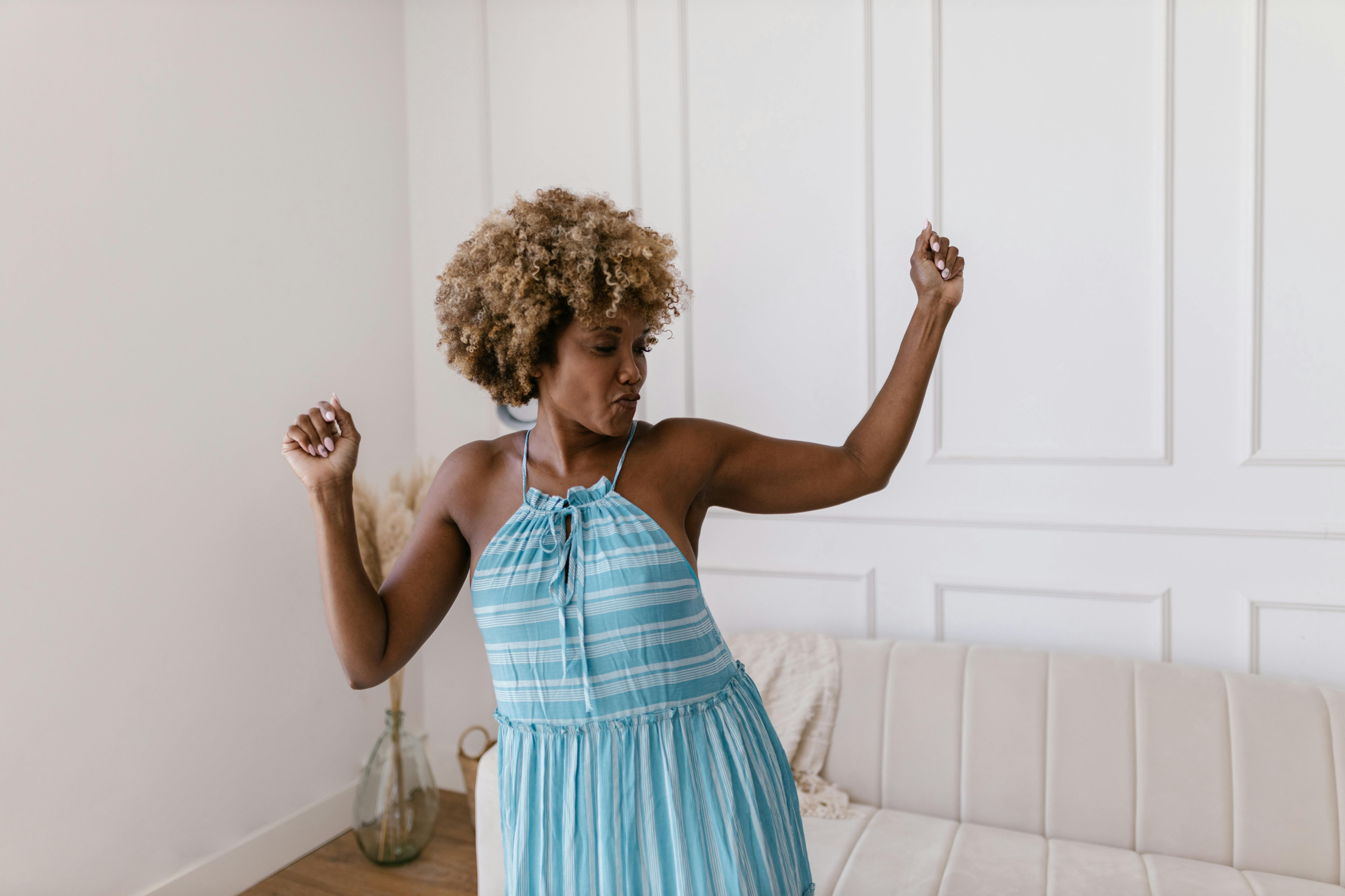 Photo of Woman Raising Both Hands · Free Stock Photo